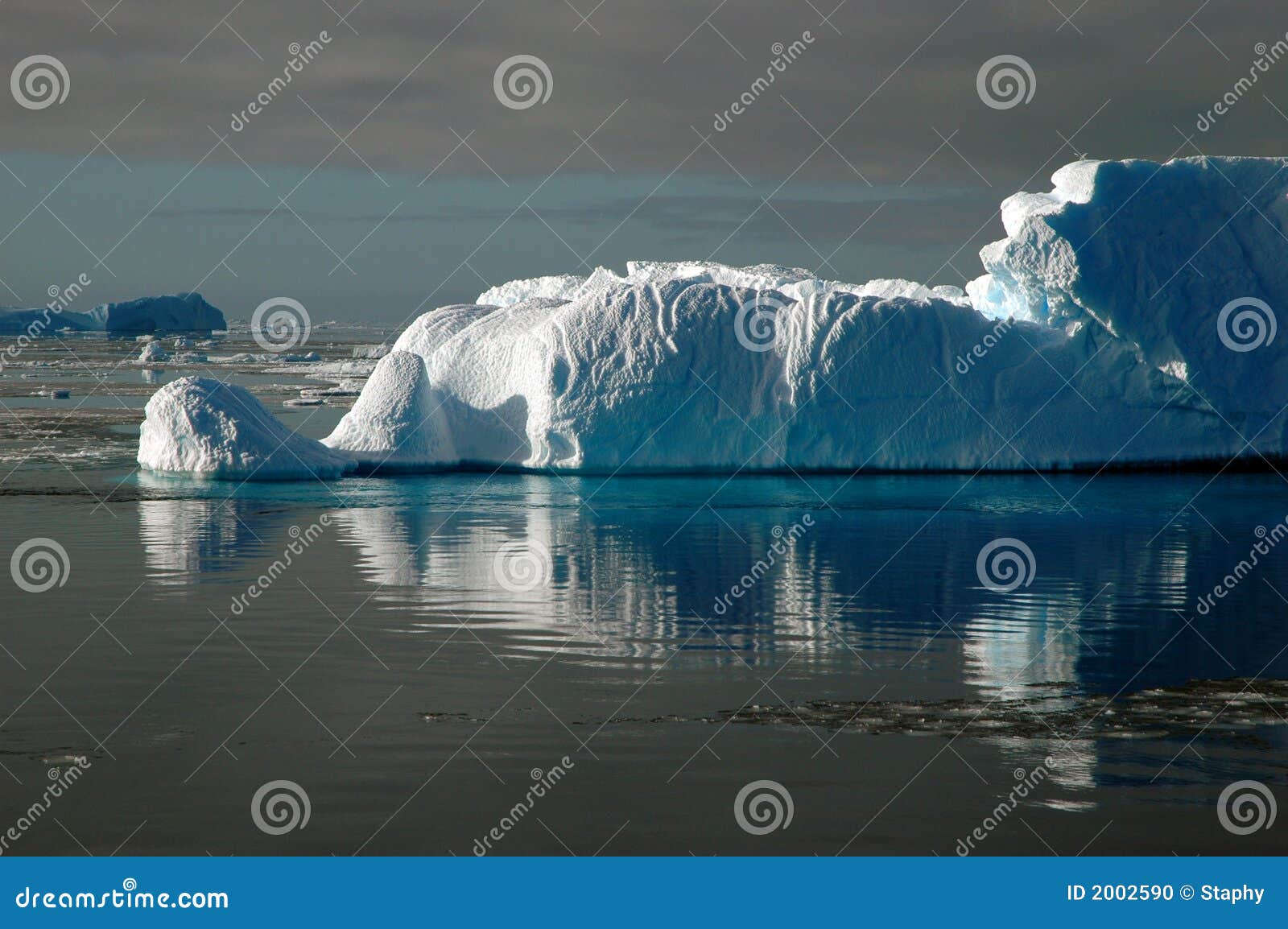 Iceberg In Sunlight With Water Reflection Picture. Image: 2002590