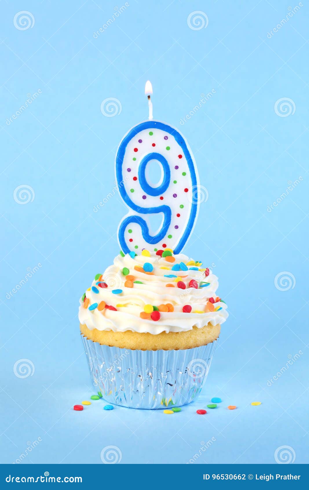 Iced Birthday Cupcake with with Lit Number 9 Candle Stock Photo - Image ...