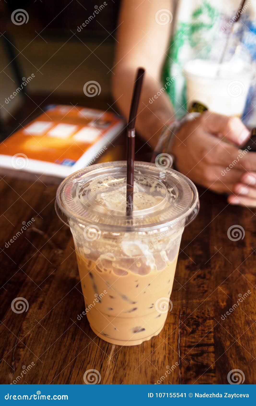 Iced Coffee In A Plastic Cup With Straw On A Wooden Table Stock Image Image Of Espresso