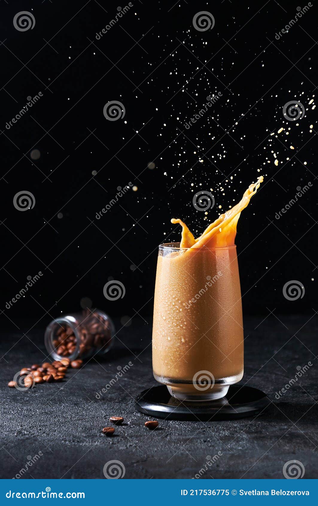 Iced Coffee with Splash in Tall Glass on Dark Background. Concept ...