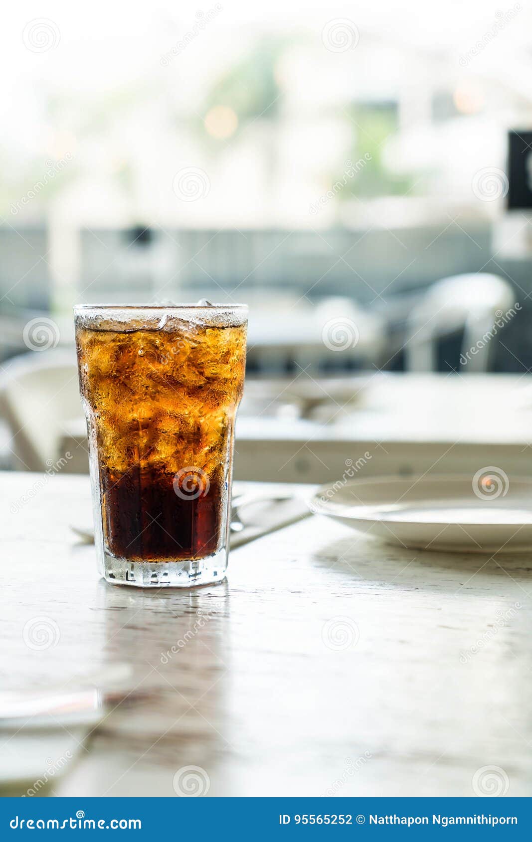 Iced cola on the table stock photo. Image of refreshment - 95565252