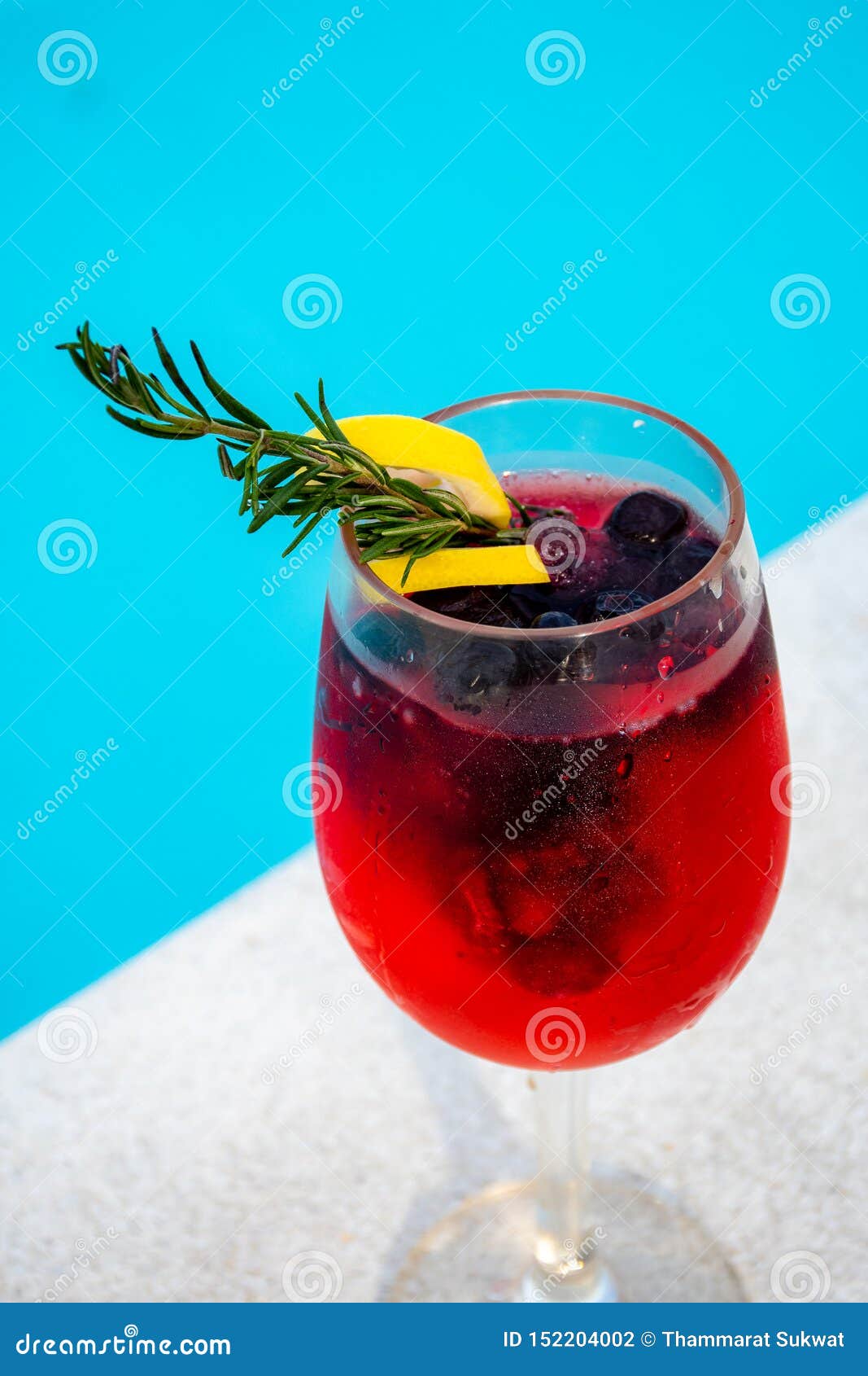 Iced Mixed Berry Cocktail Against Pool Side Stock Photo - Image of ...