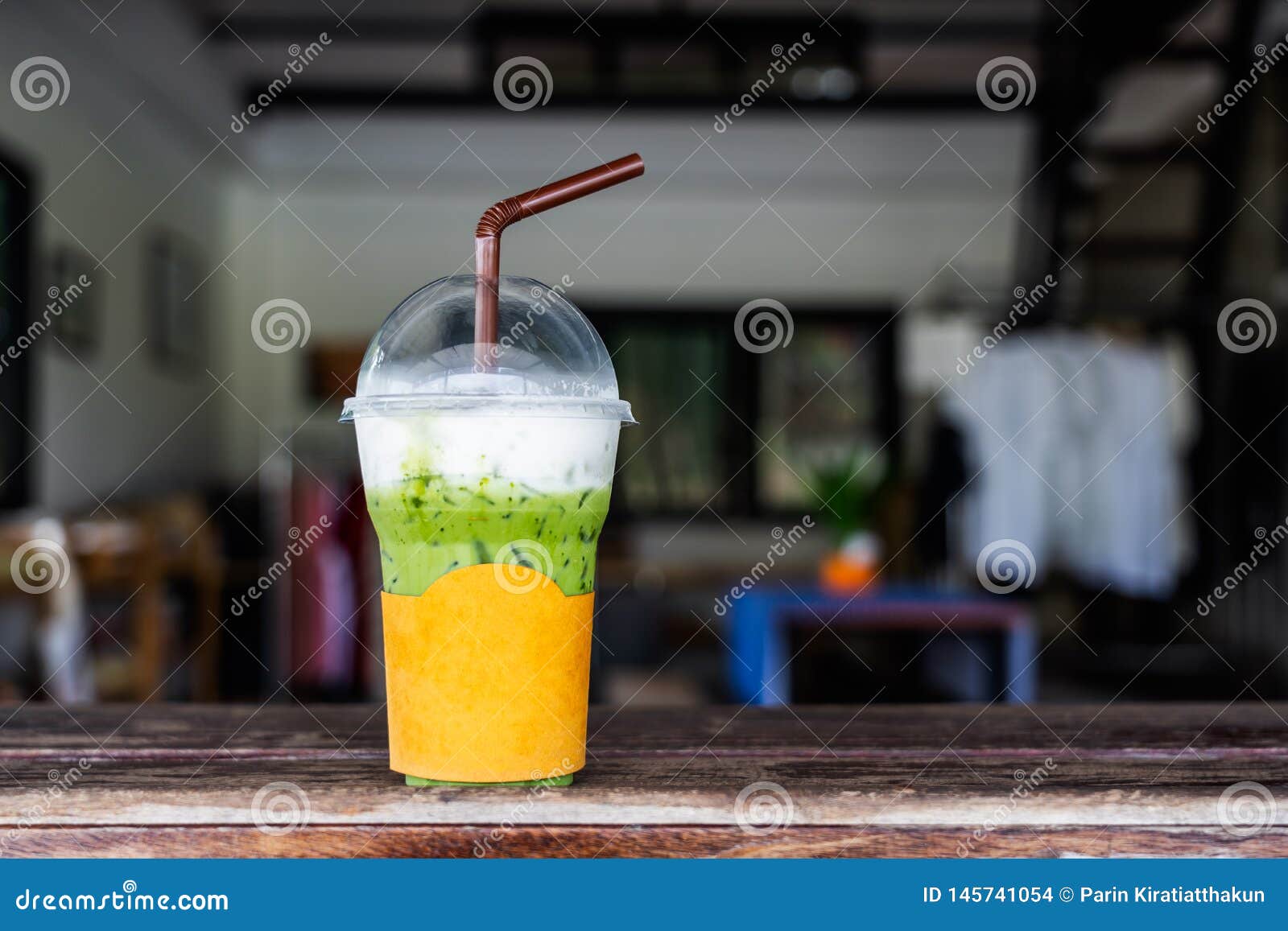 Iced Green Tea in Plastic Cup on Wood Table in the Cafe Stock Photo ...