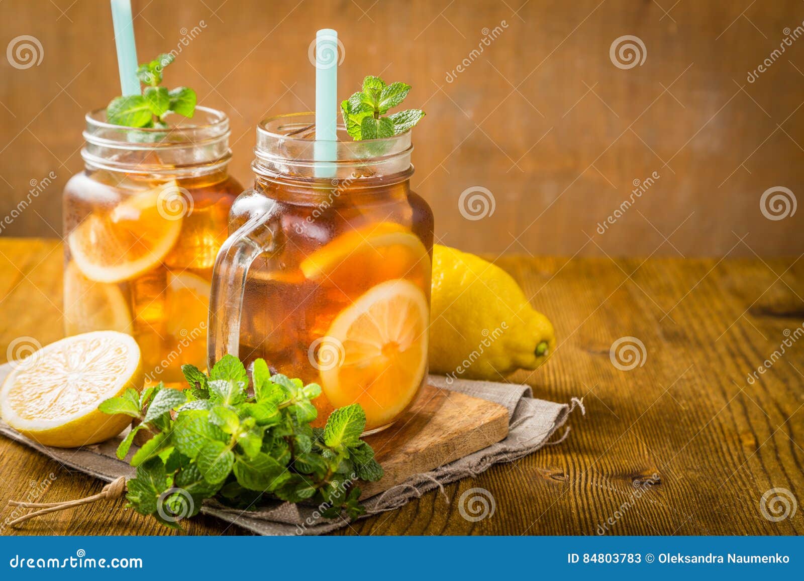 Iced tea in glass jars stock image. Image of slice, outdoors - 84803783