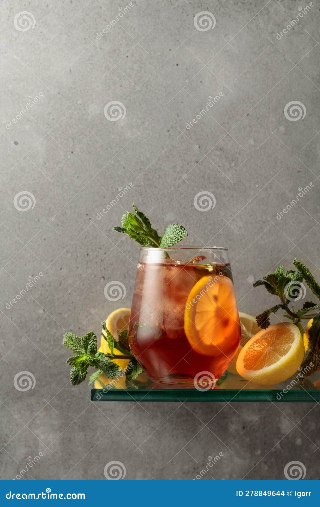 Iced Tea with Lemon and Mint on the Background of the Grey Concrete ...