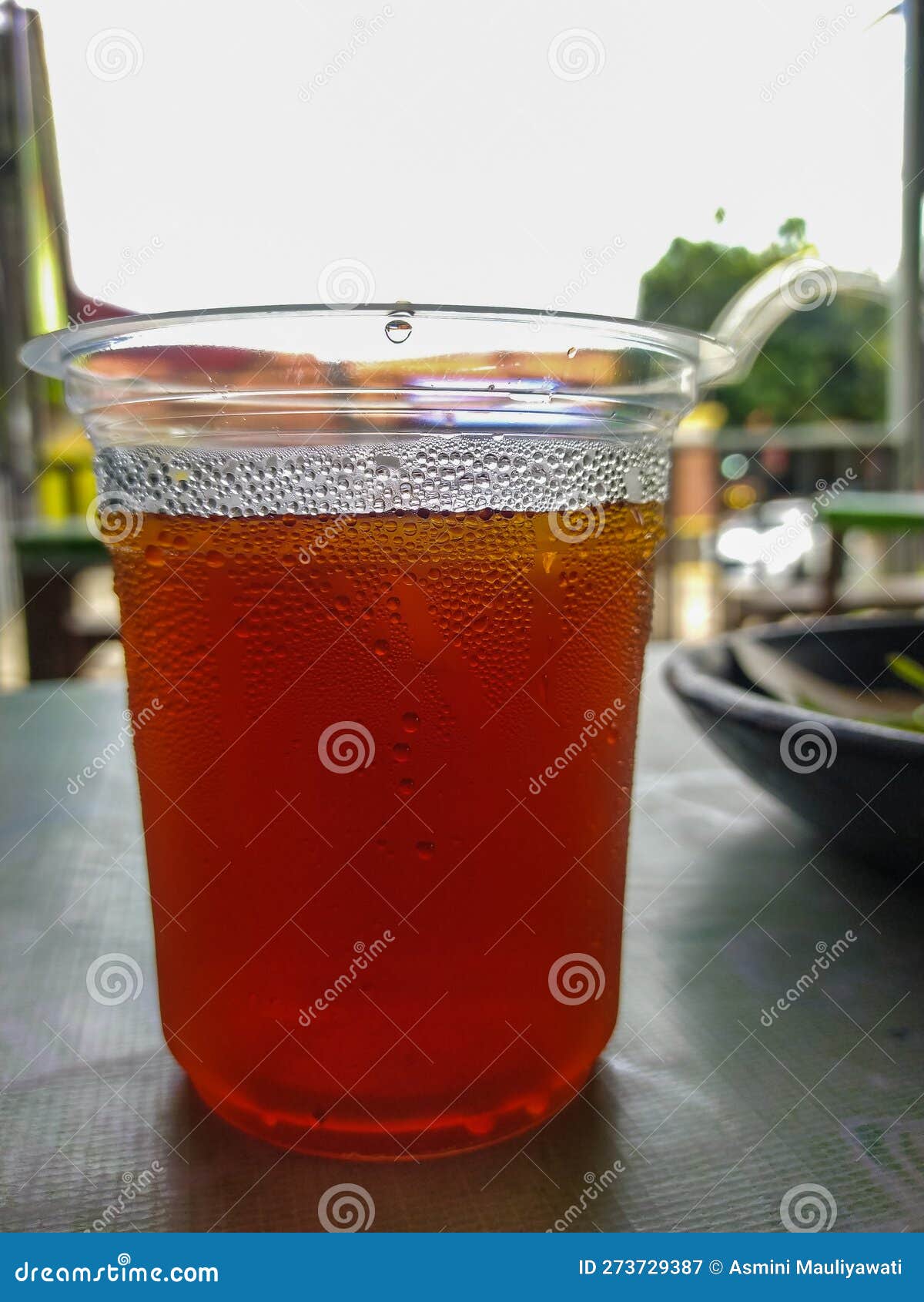 Iced Tea in a Transparent Plastic Cup Which is Refreshing during the ...