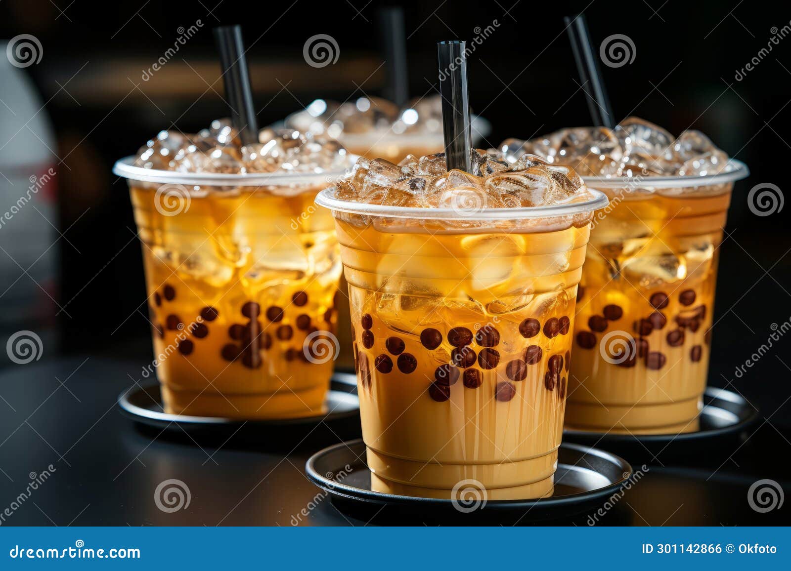 Iced Thai Milk Tea with Tapioca Bubbles in Plastic Cups on Table Stock ...