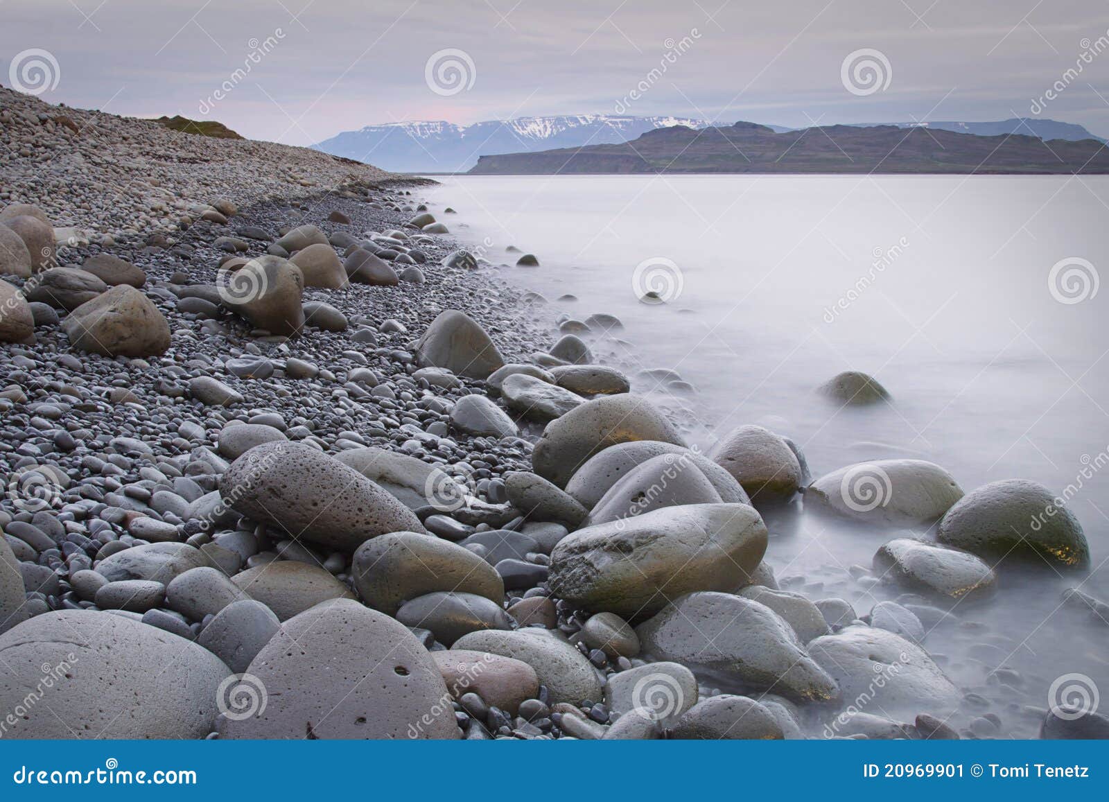 Iceland: Pebbly beach stock image. Image of calm, cliff - 20969901