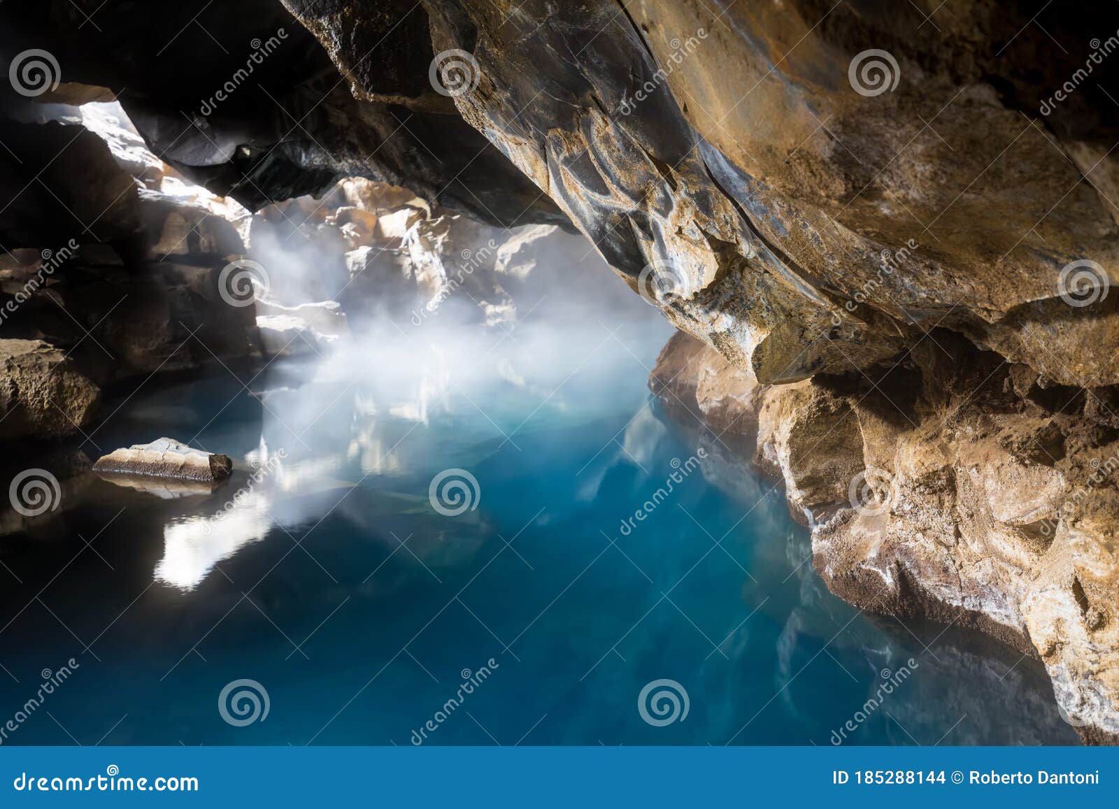 Icelandic Cave with Blue Water Stock Photo - Image of natural, blue ...