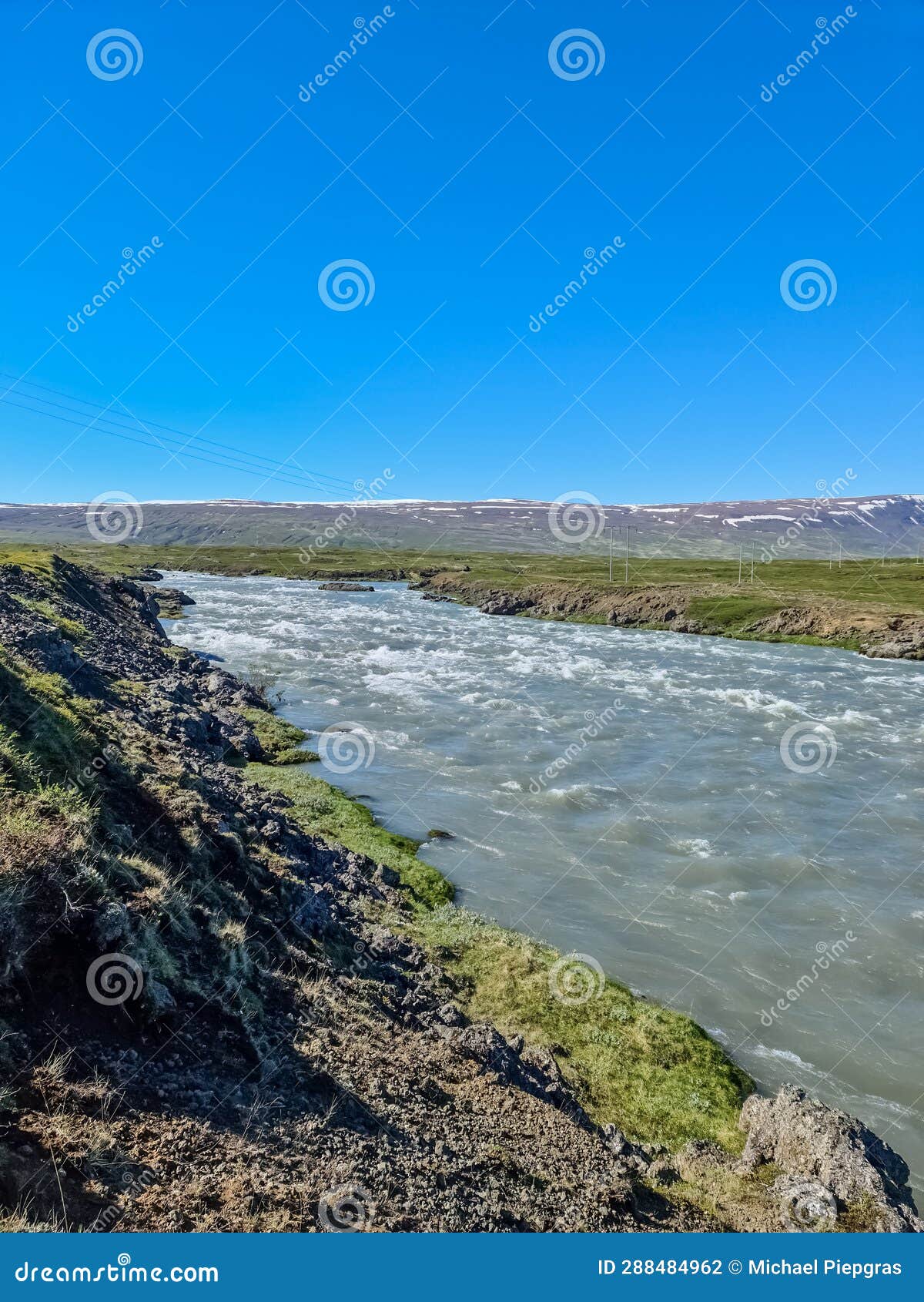 Icelandic Landscape with Flowing Rivers Surrounded by Rocks and Grass ...