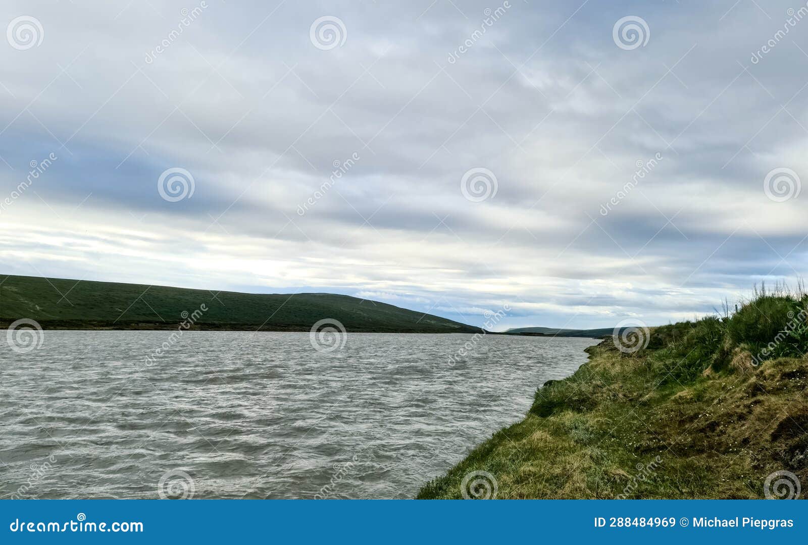 Icelandic Landscape with Flowing Rivers Surrounded by Rocks and Grass ...