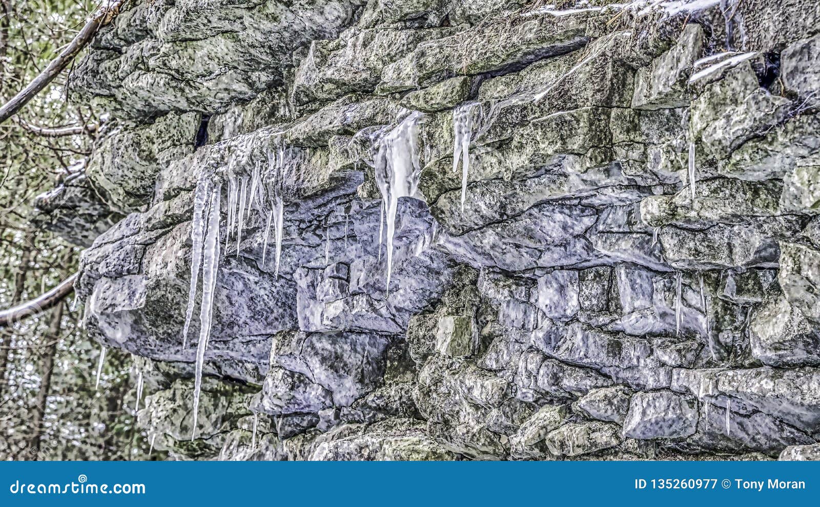 Icicles on a Rock Cliff Face in Late Fall Stock Image - Image of skies ...