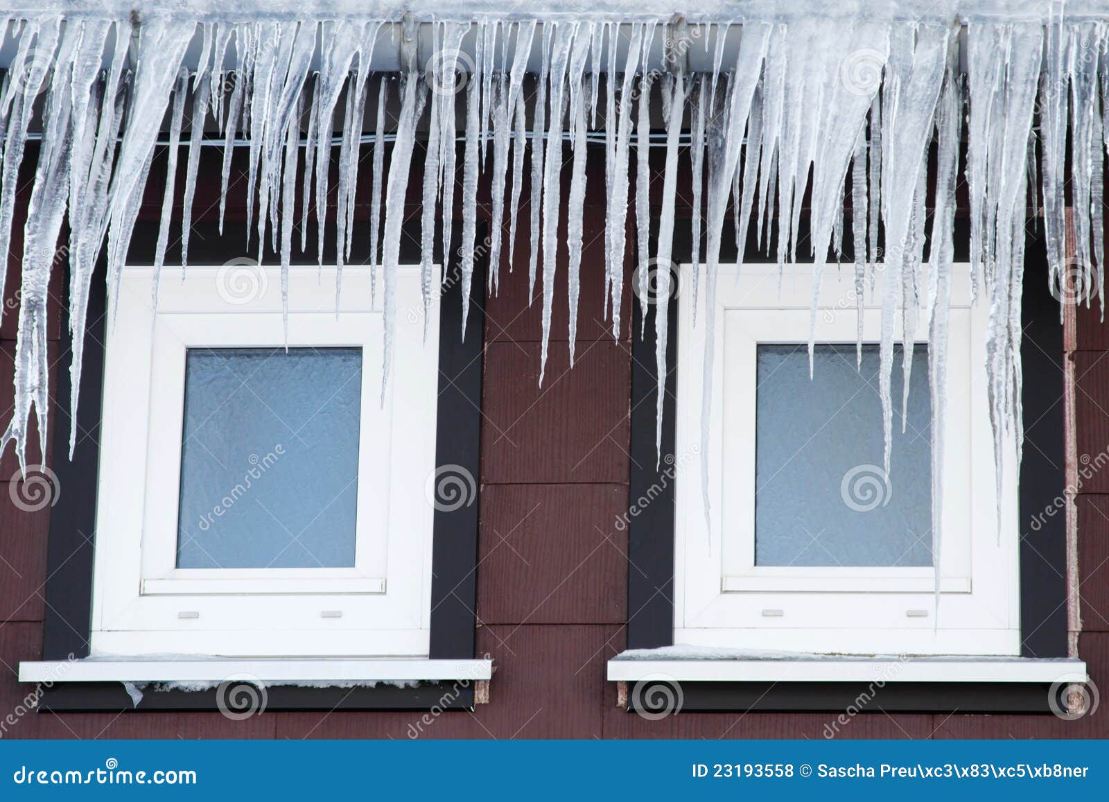 Icicles in Front of Two Windows Stock Photo - Image of house, windows ...
