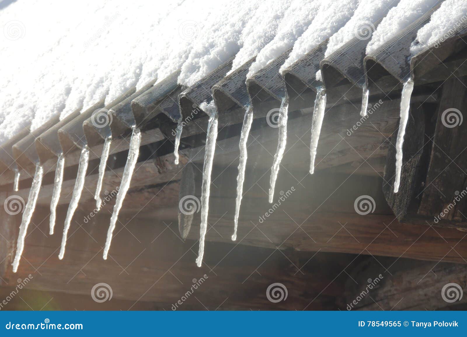 Icicles hang on the roof stock image. Image of frozen - 78549565