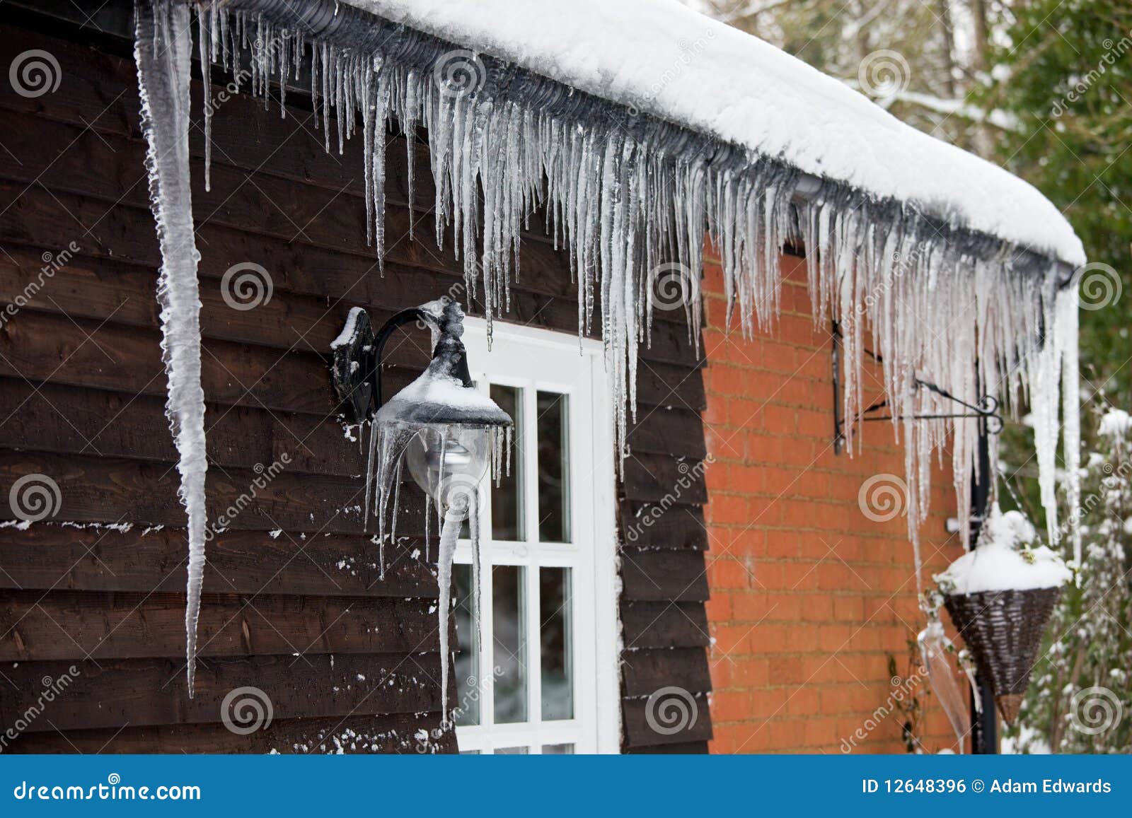 Icicles Hanging from a Drainpipe Ouside a House Stock Photo - Image of ...