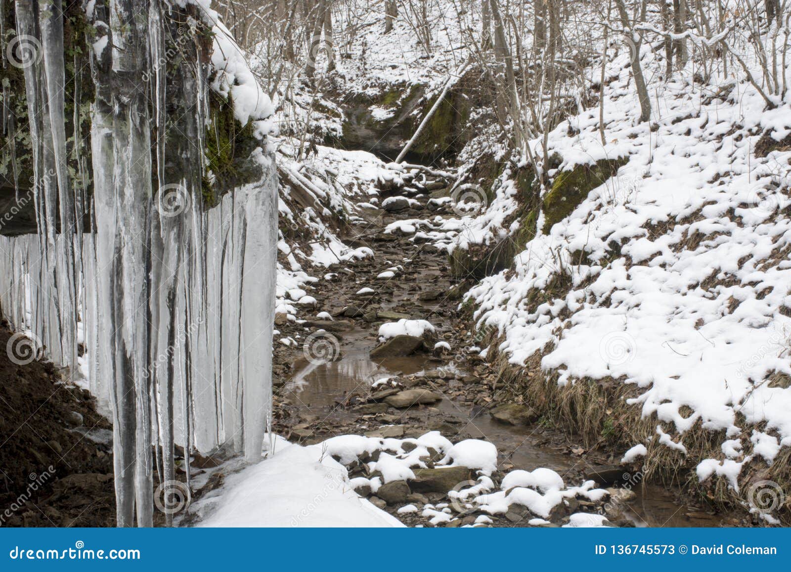 Icicles Hanging from Rock Outcropping Stock Image - Image of rocks ...