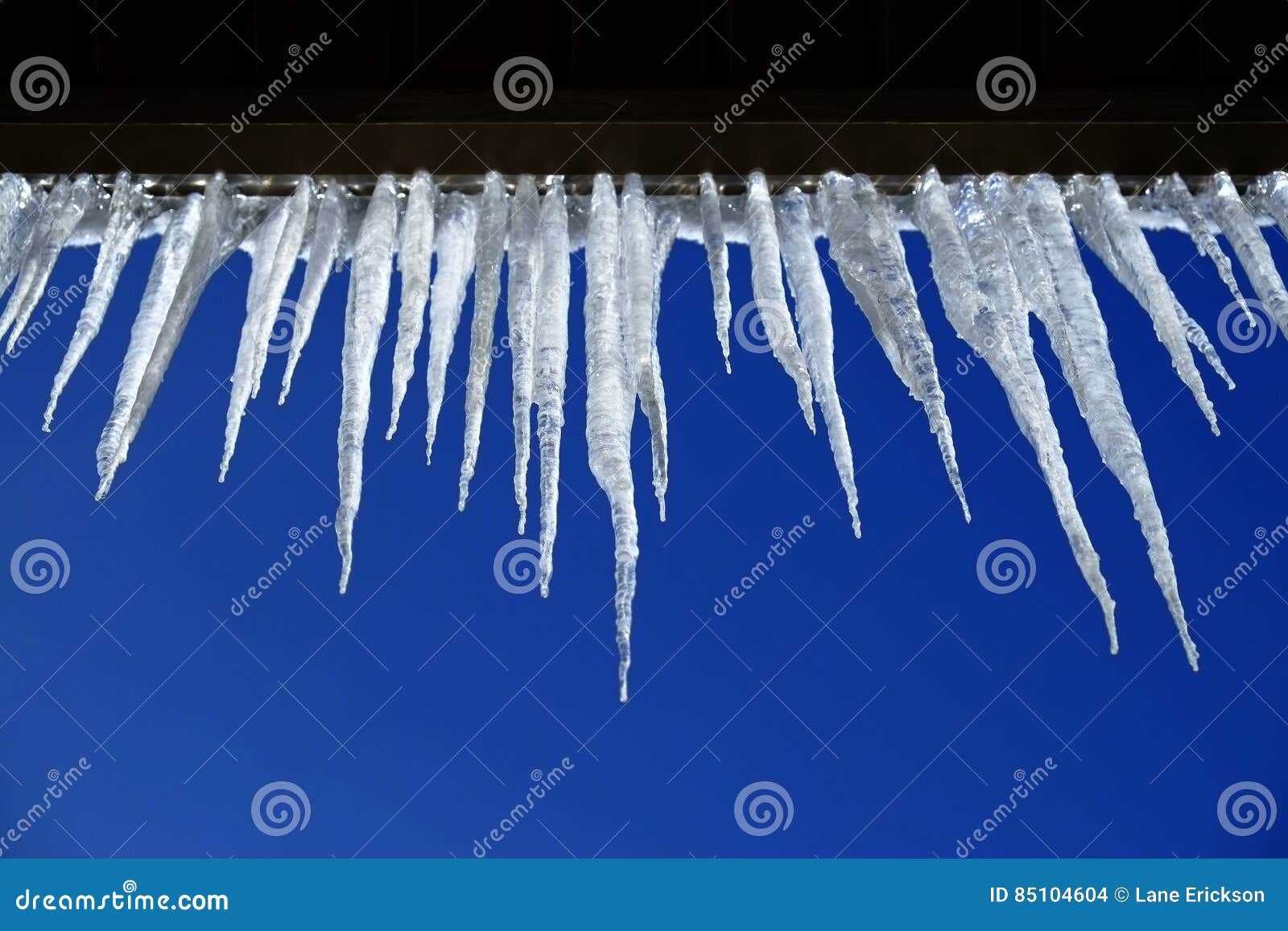 Icicles Hanging from Rooftop of Home Melted Ice Dripping Stock Photo ...