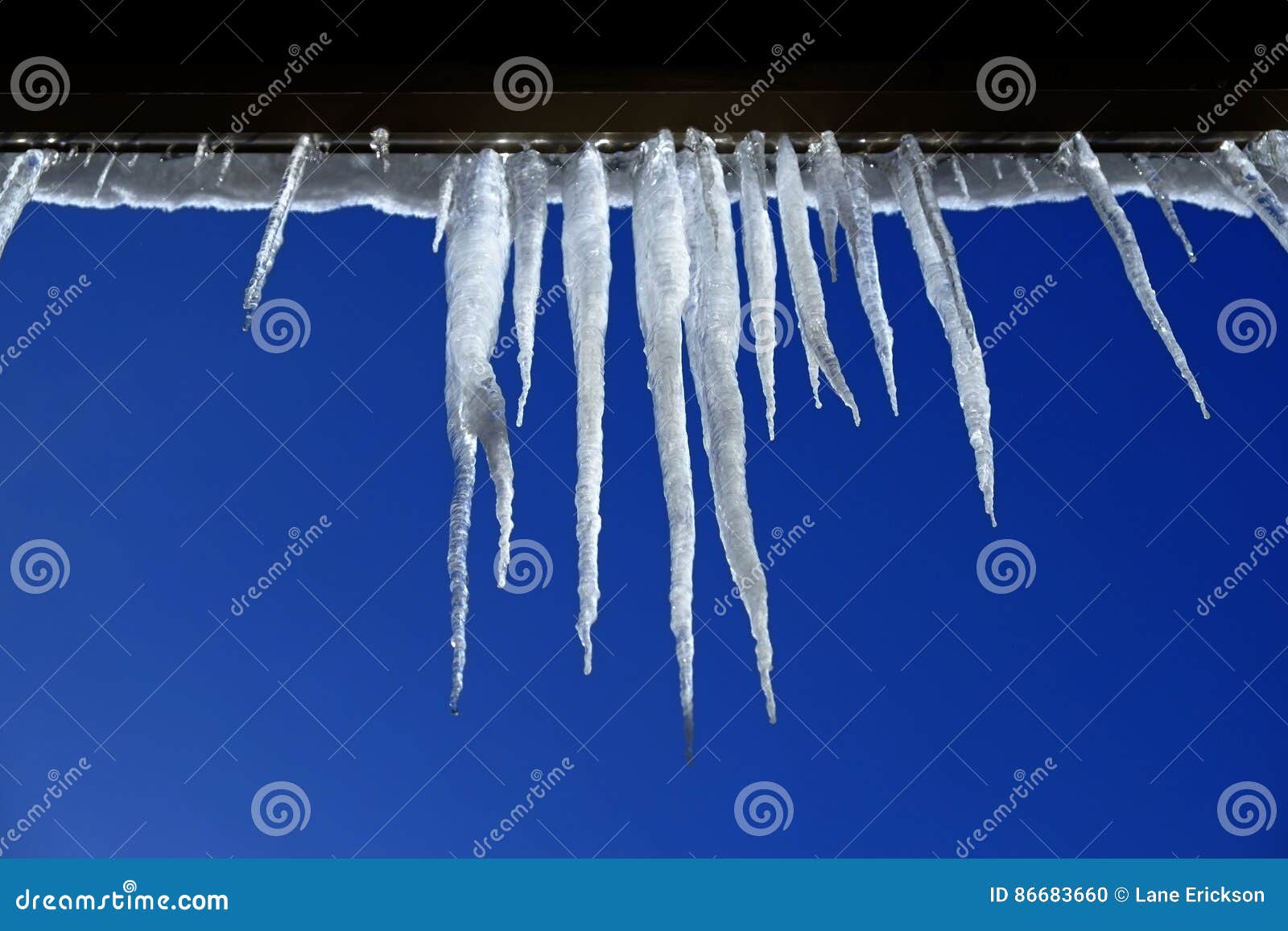 Icicles Hanging from Rooftop of Home Melted Ice Dripping Stock Photo ...