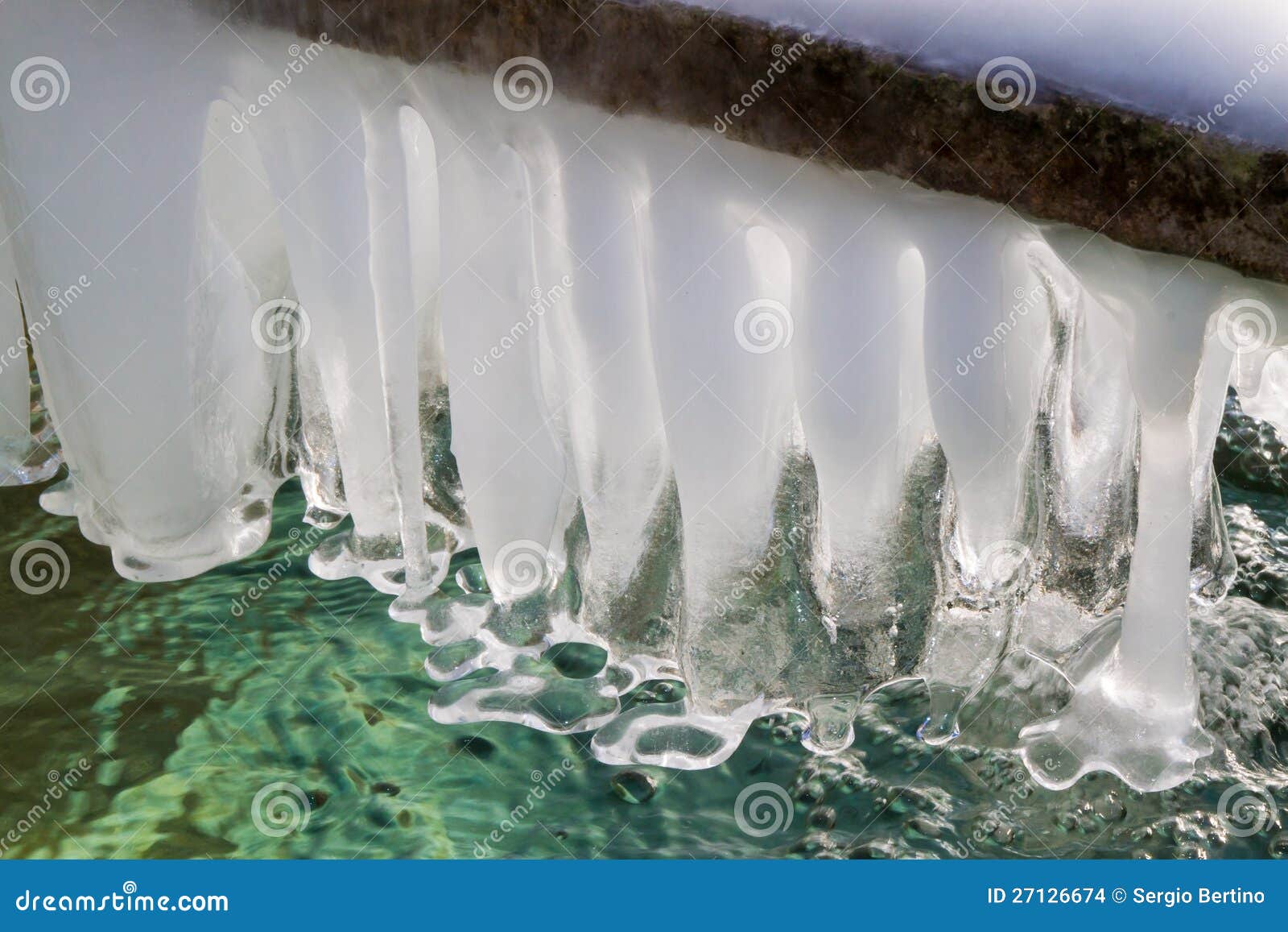 Icicles over water stock photo. Image of thick, season - 27126674