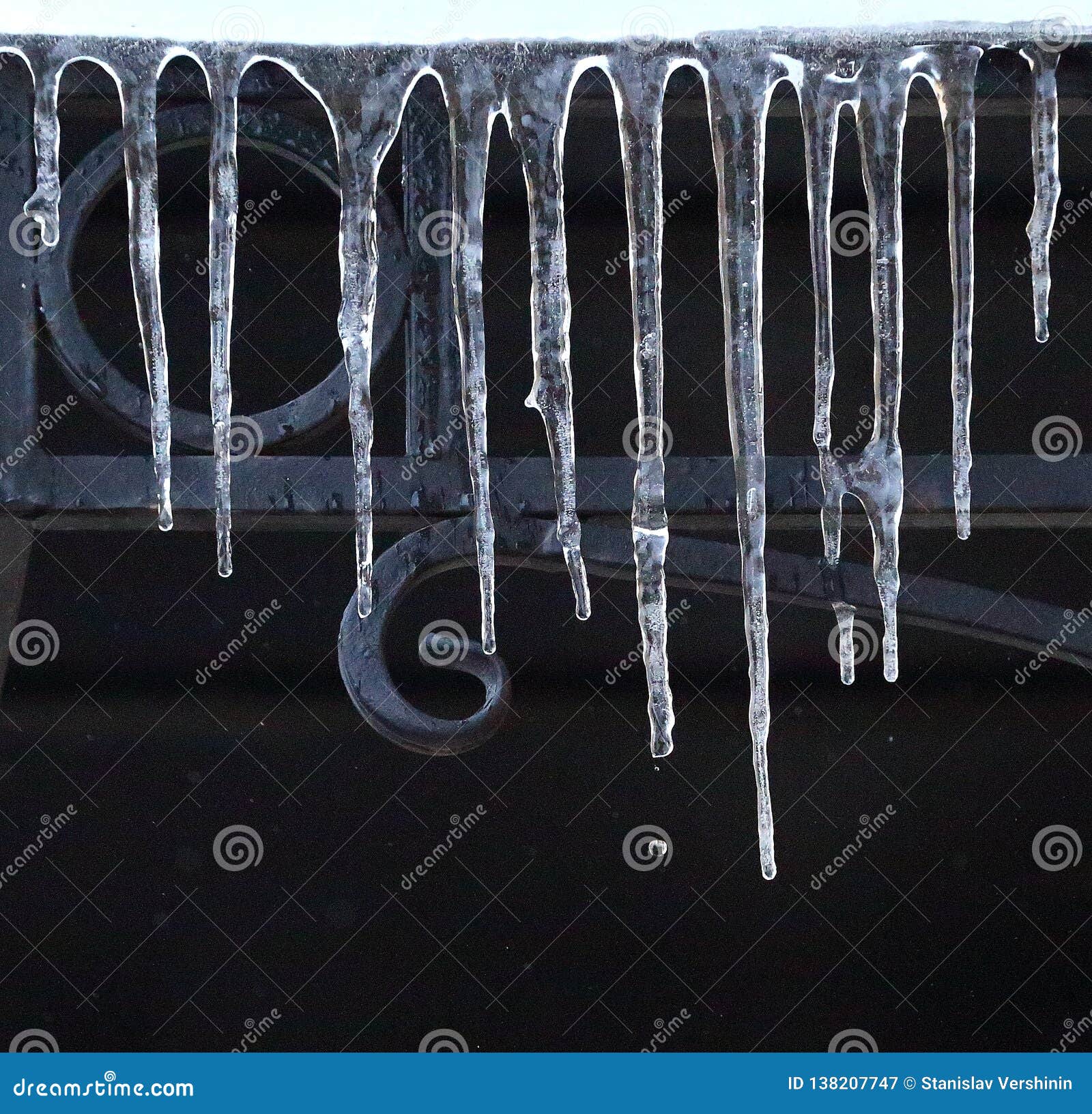 Icicles on the Roof and Drops Falling from Them Stock Image - Image of ...