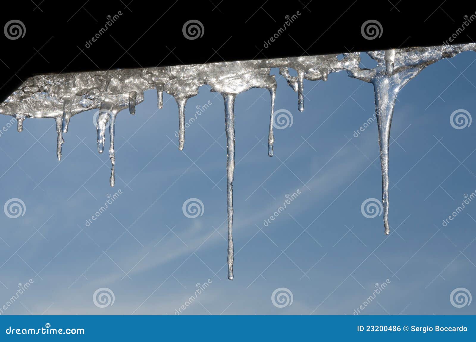 Icicles in the sun stock photo. Image of light, cornice - 23200486
