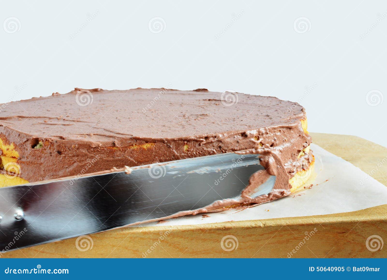Icing a sponge cake stock image. Image of dessert, pastry - 50640905