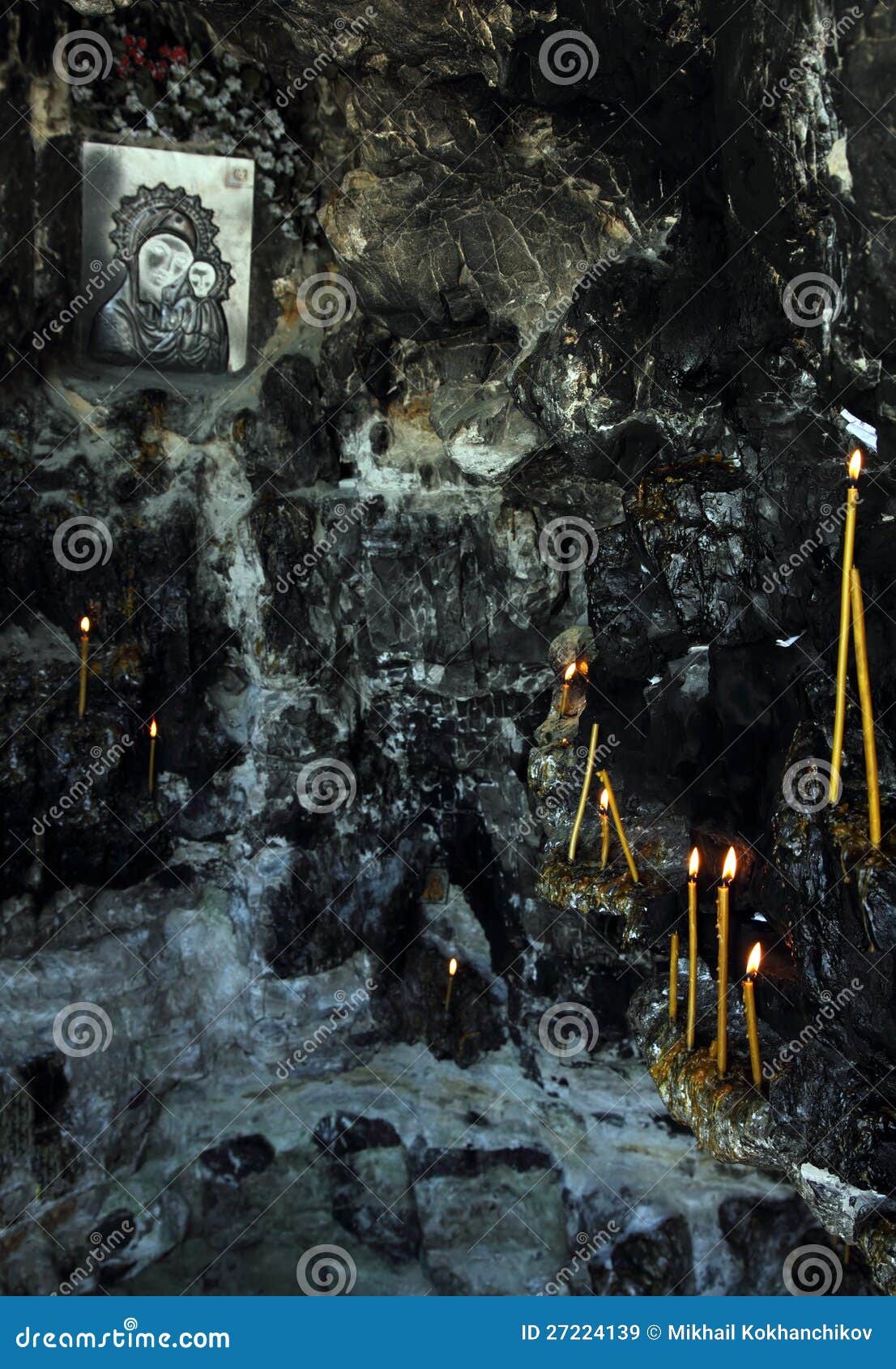 Icon and candles in grotto stock image. Image of pilgrimage - 27224139