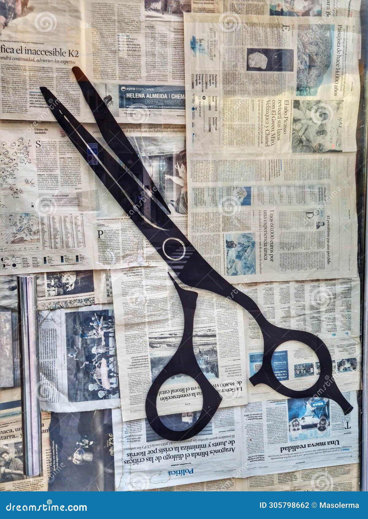Icon of Scissors on a Background of Newspaper Pages Written in Spanish ...