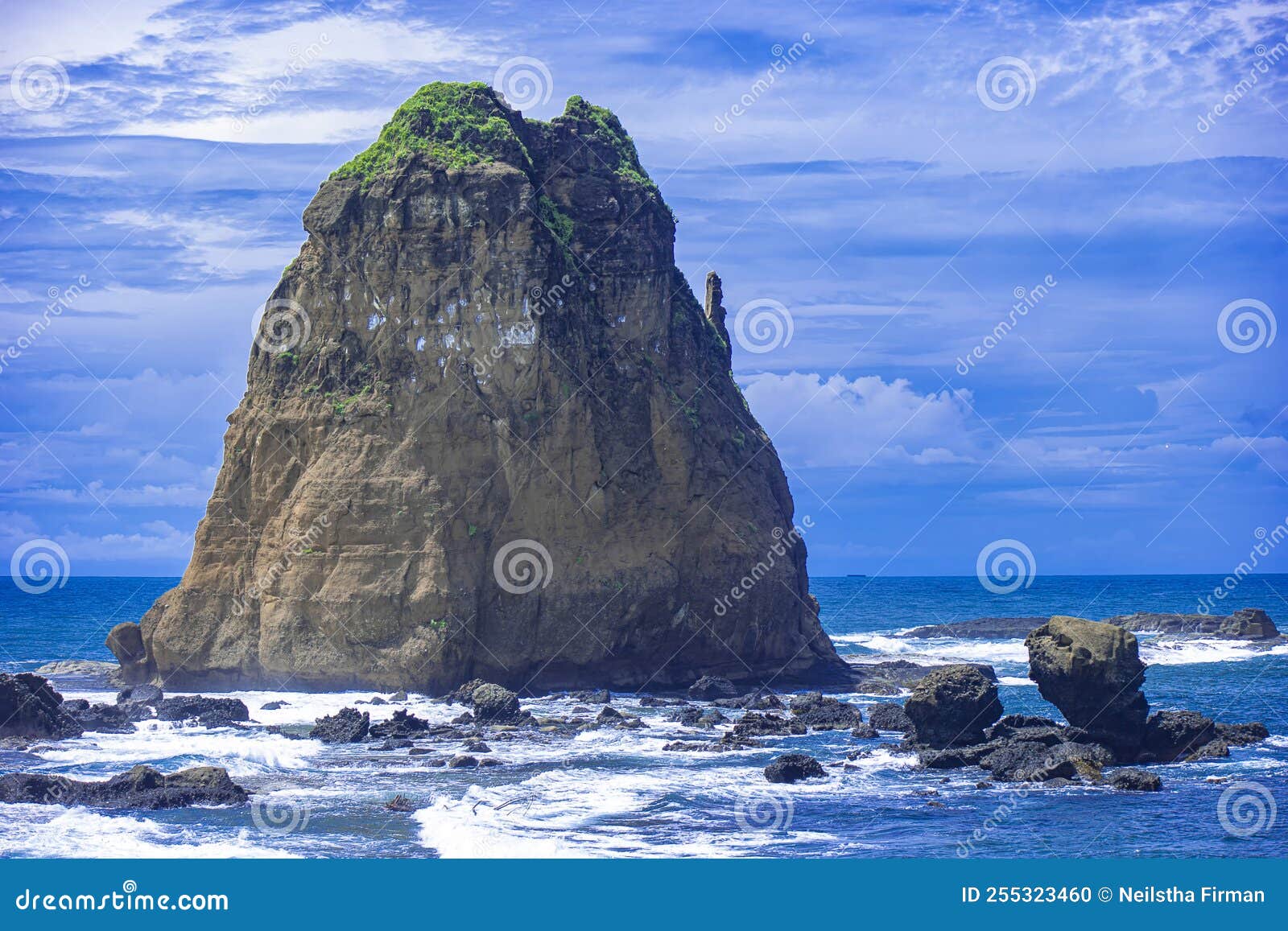 Iconic rock on the ocean stock photo. Image of coastline - 255323460
