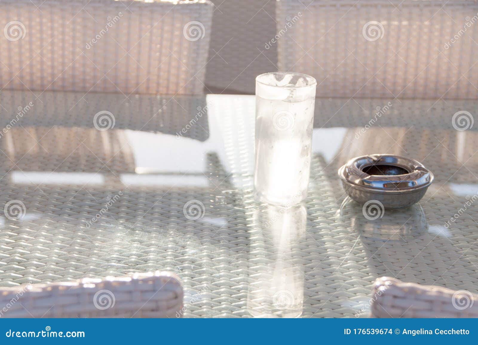 Icy Cold Glass of Water Dripping Water Drops on Glass Table with ...