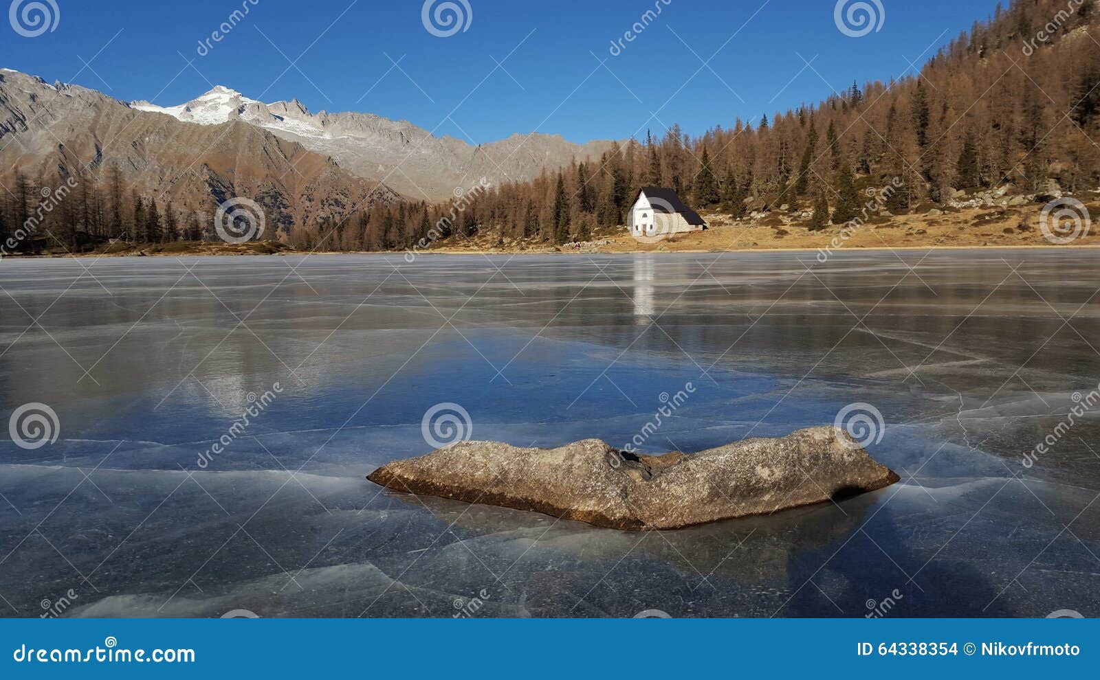 Icy lake stock photo. Image of campiglio, panorama, wood - 64338354