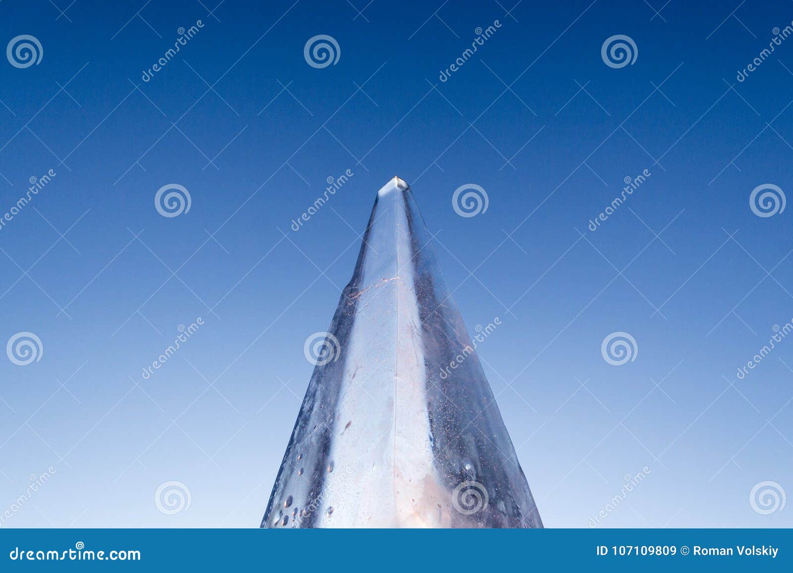 Icy Triangular Top on a Blue Sky Background. Close-up. the Concept of ...