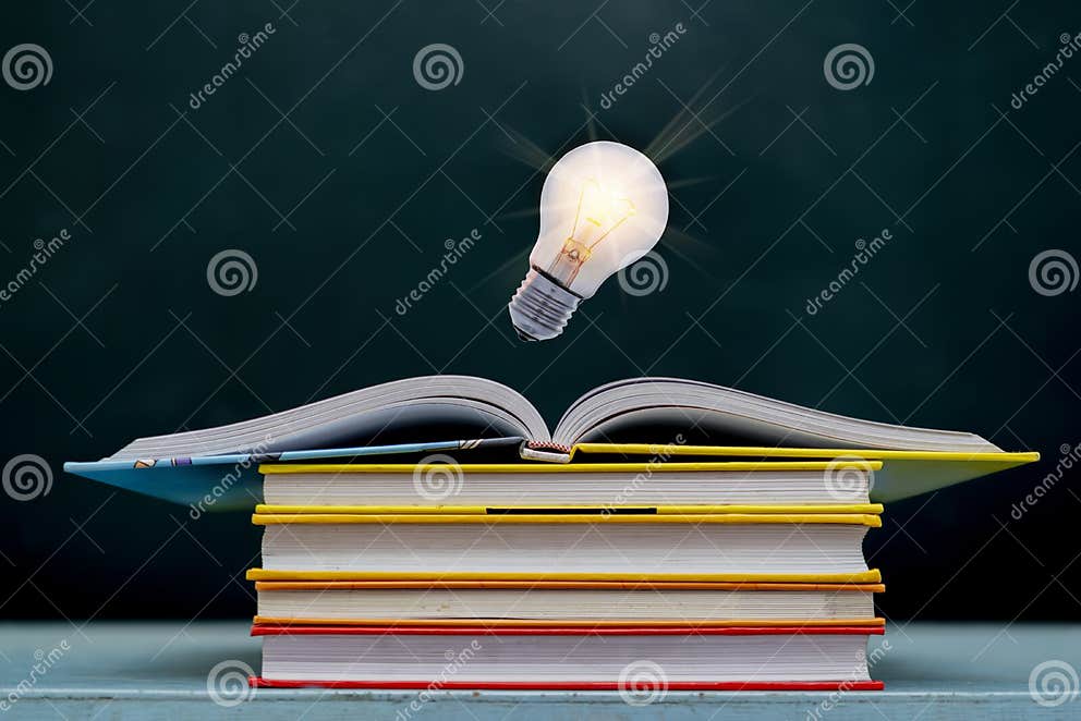 Idea Concept, Light Bulb on Book with Blackboard Stock Photo - Image of ...
