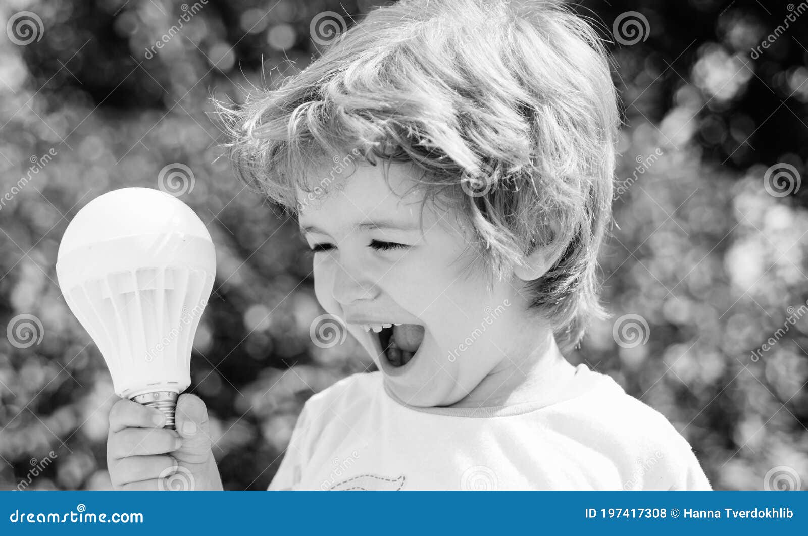 Idea. Happy Child with a Light Bulb. the Concept of a Successful Idea ...