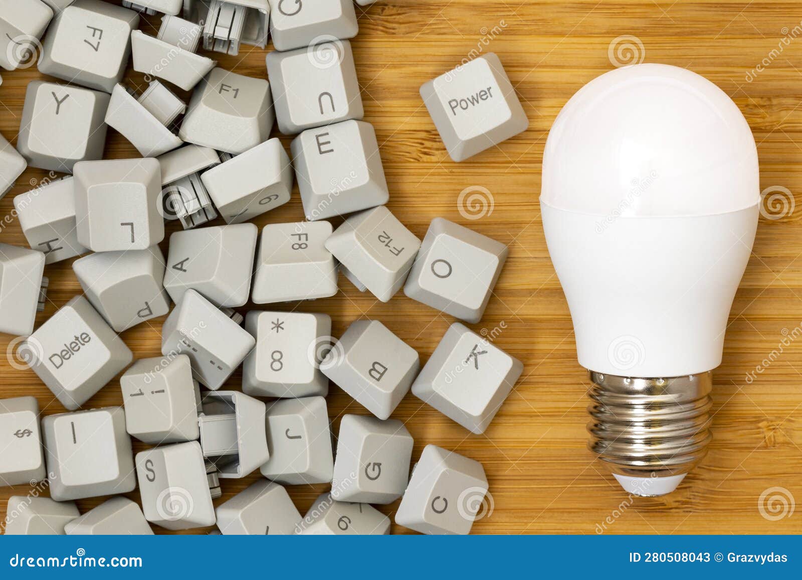 LED Light Bulb and Pile of Computer Keyboard Keys Stock Image - Image ...