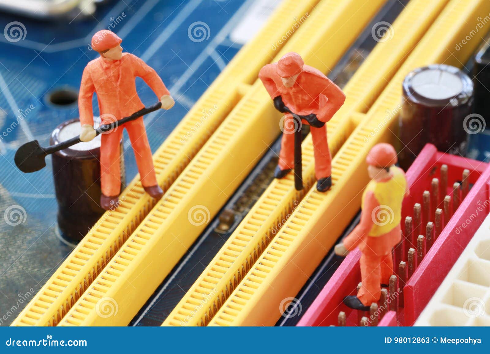 Idea of a Worker is Miners are Digging for Ore on Computer Mainboard ...