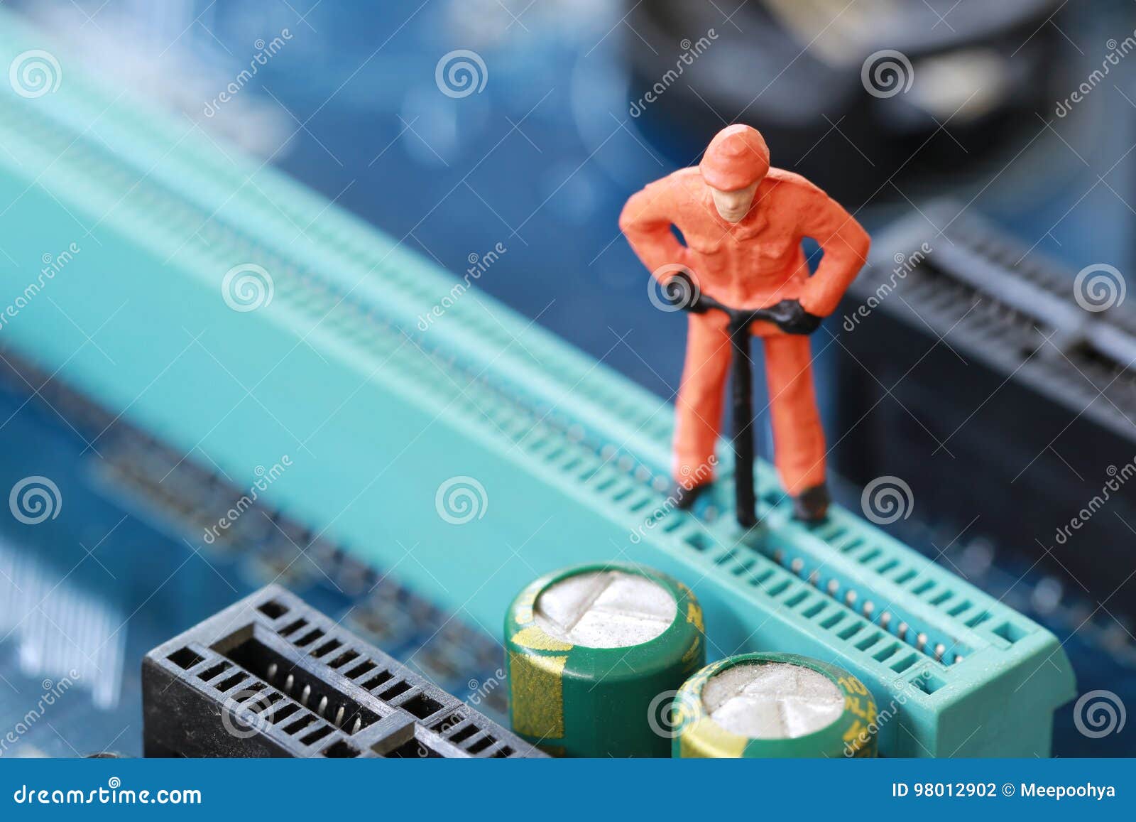Idea of a Worker is Miners are Digging for Ore on Computer Mainboard ...