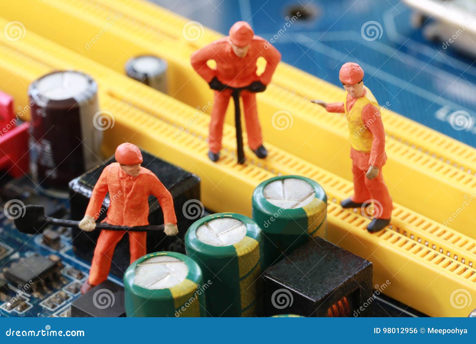 Idea of a Worker is Miners are Digging for Ore on Computer Mainboard ...
