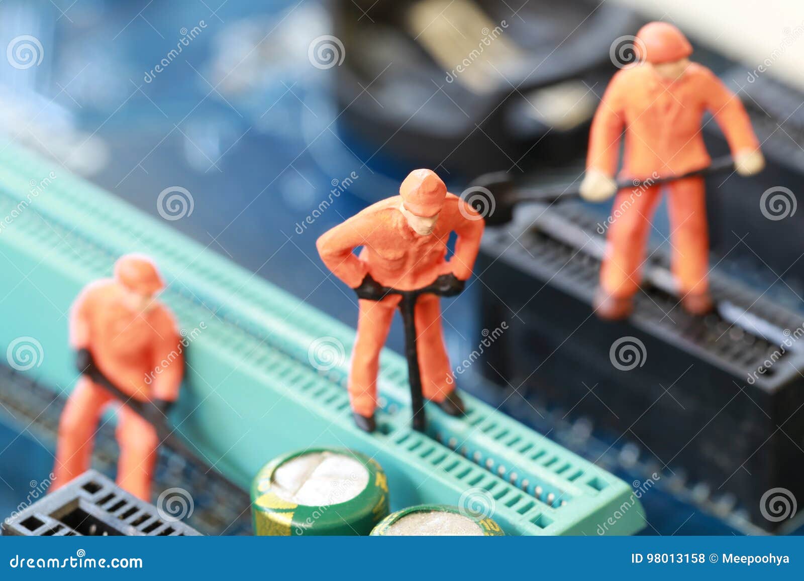 Idea of a Worker is Miners are Digging for Ore on Computer Mainboard ...