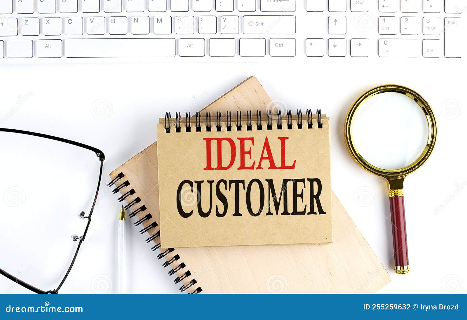 IDEAL CUSTOMER Text in the Office Notebook with Keyboard, Magnifier and ...