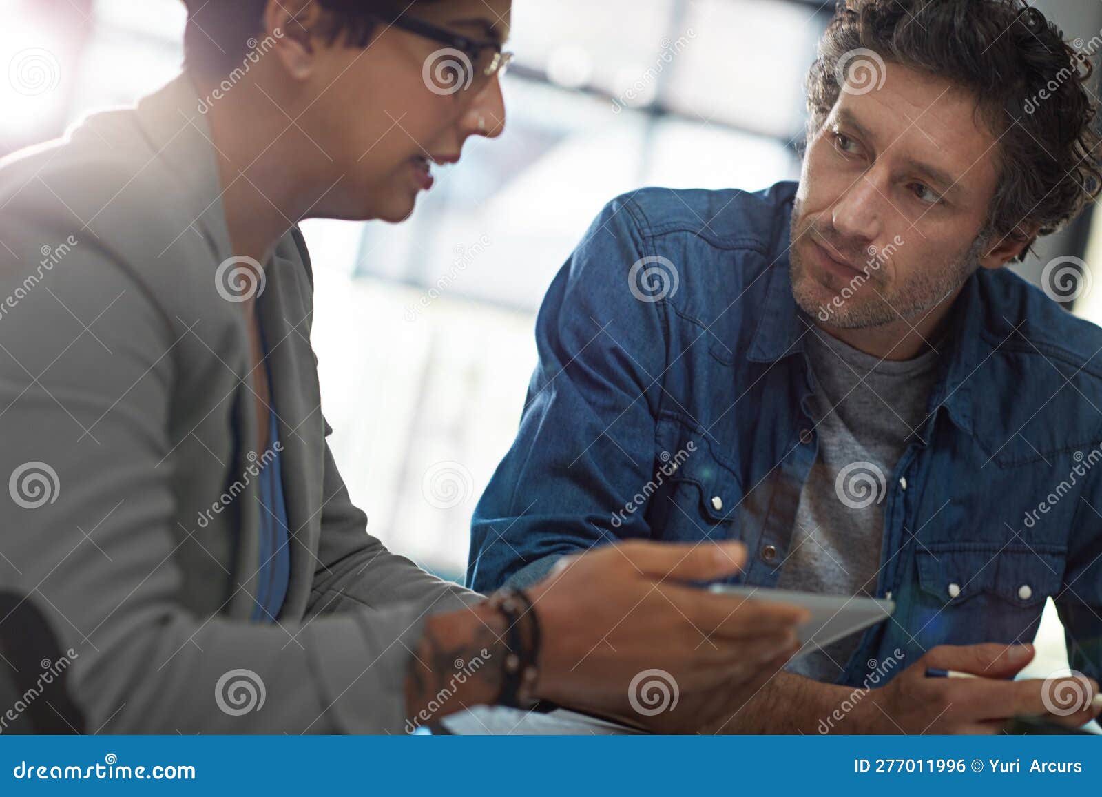 Ideas Exchange. Two Business Colleagues Meeting in the Office. Stock ...