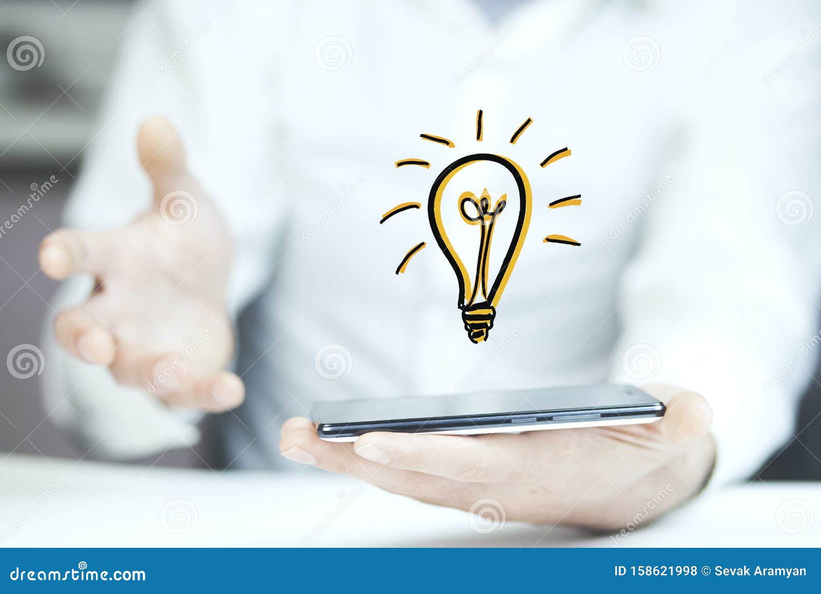 Ideas Light Bulb with Phone in a Hand Stock Photo - Image of object ...
