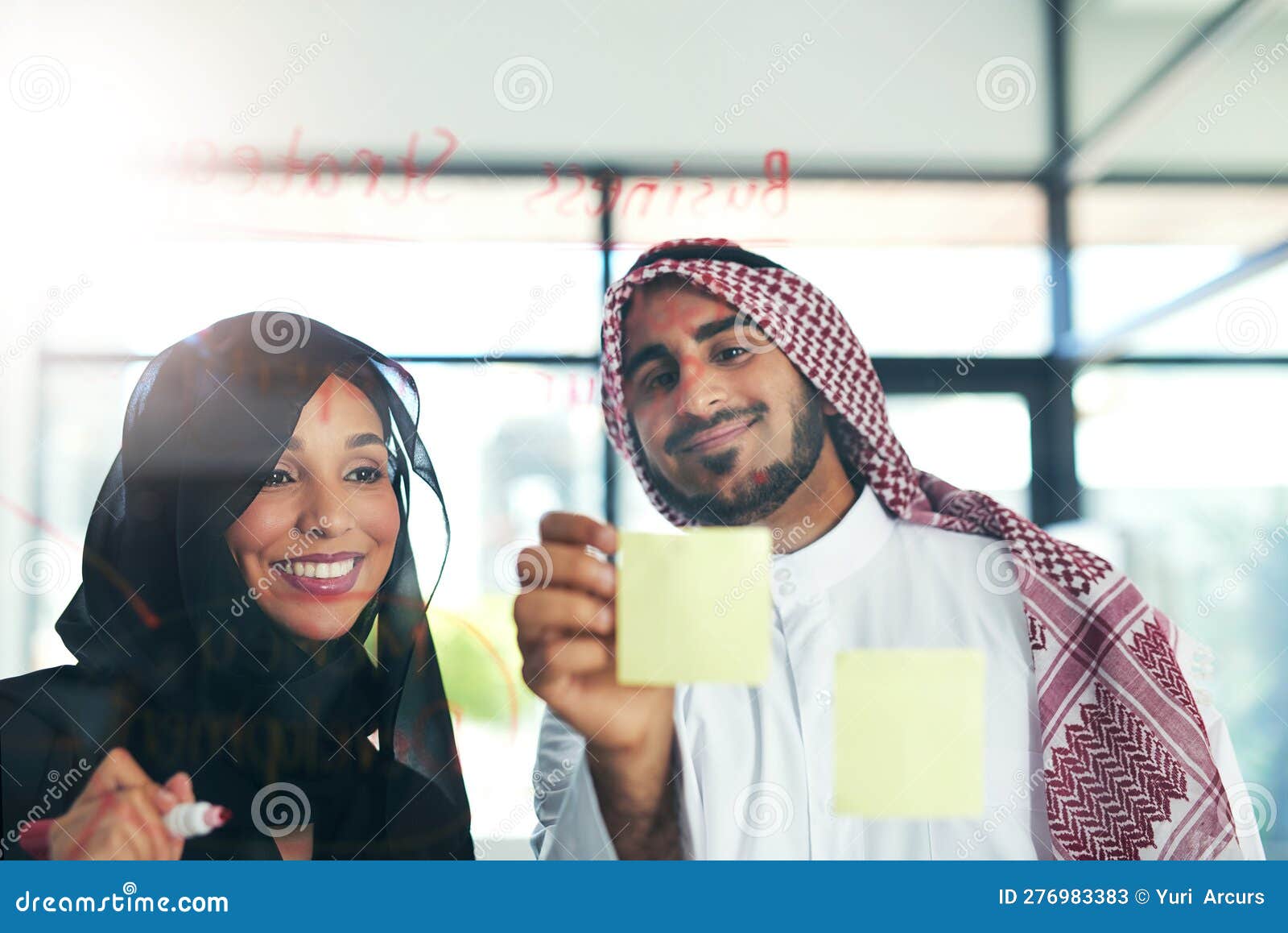 Ideating and Innovating. Two Muslim Colleagues Having a Brainstorming ...