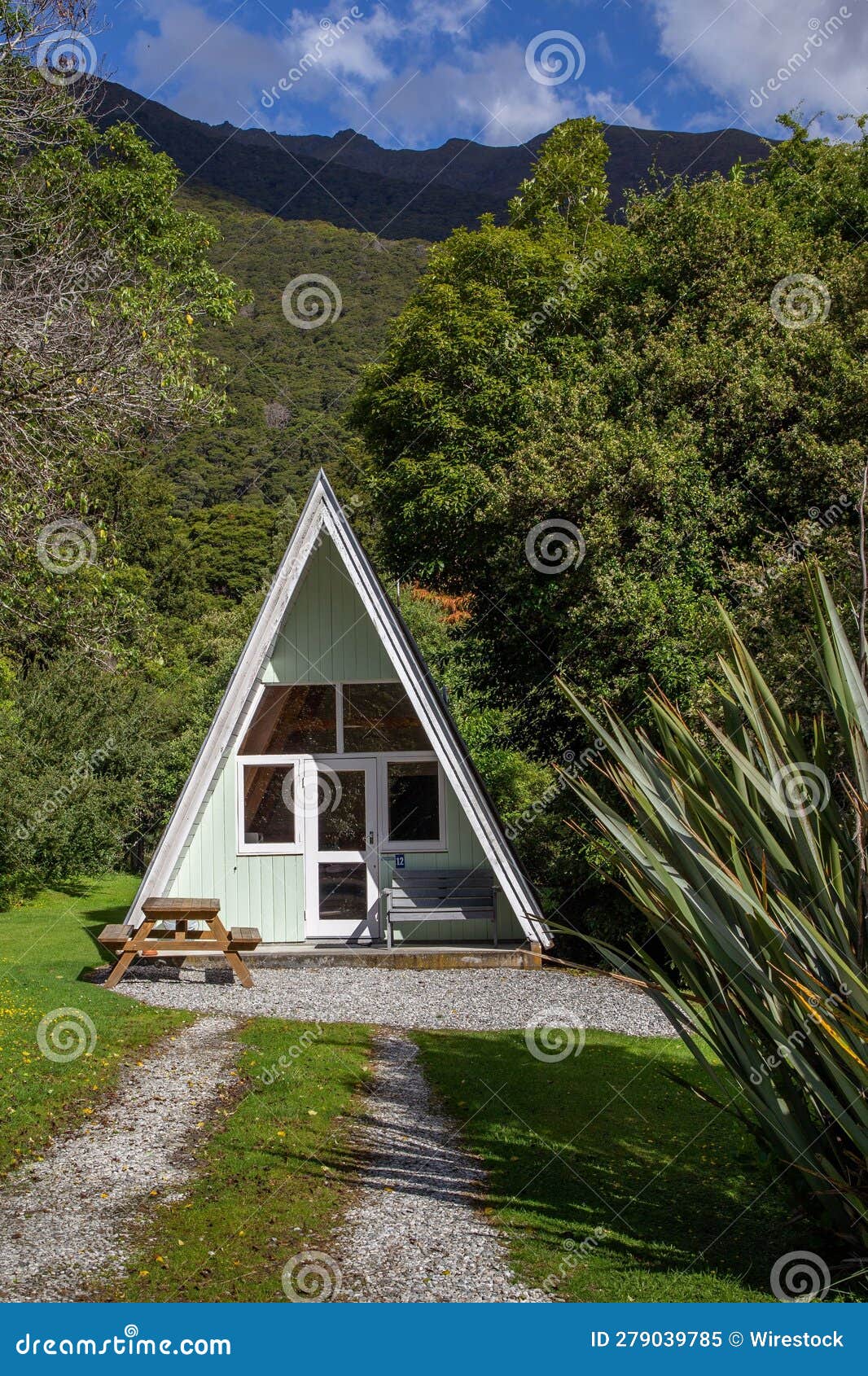 Idyllic Mountain Retreat with a Triangular-shaped Cabin Surrounded by ...