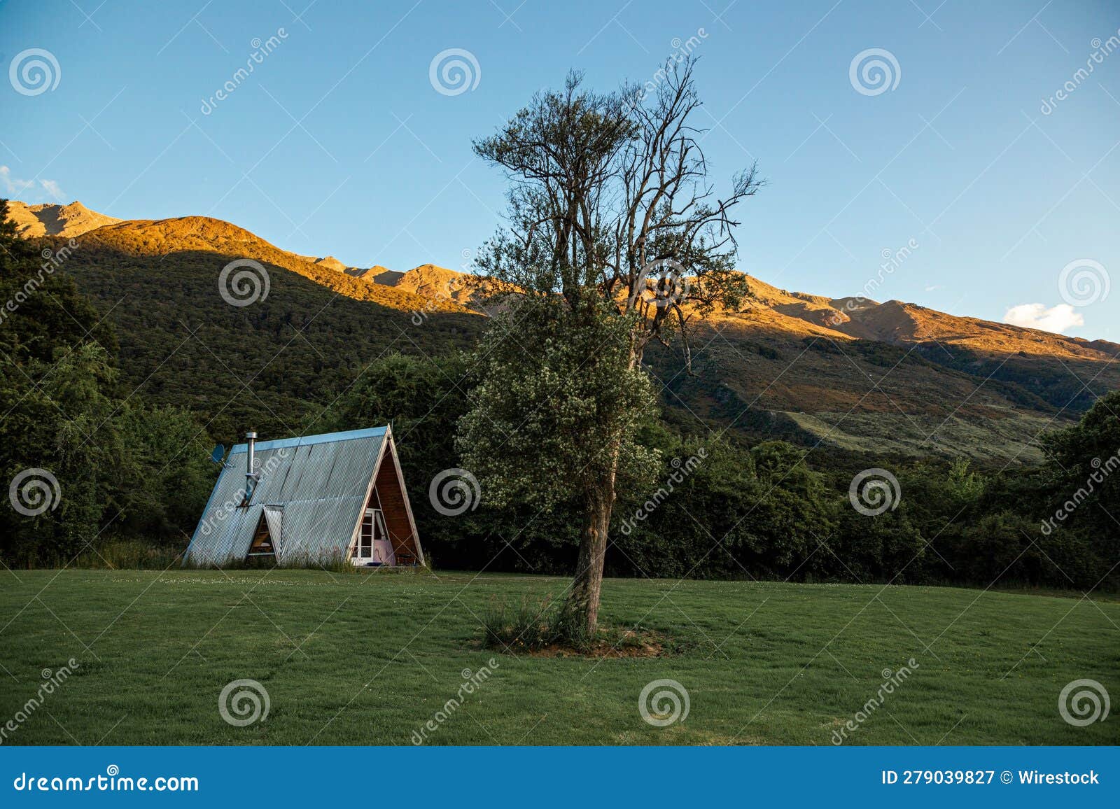 Idyllic Mountain Retreat with a Triangular-shaped Cabin Surrounded by ...