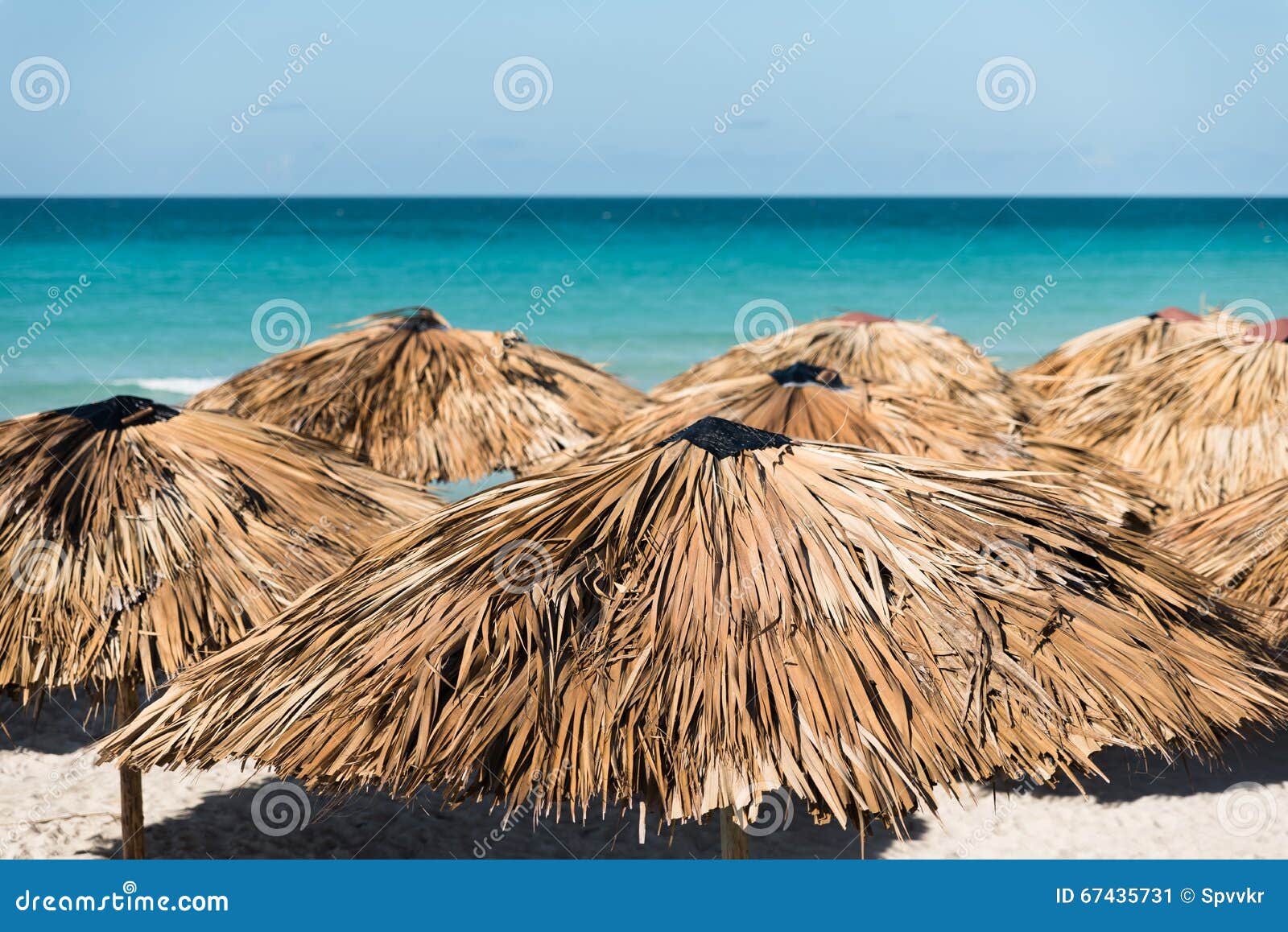 Idyllic Ocean View with Focus on Straw Shades Stock Image - Image of ...
