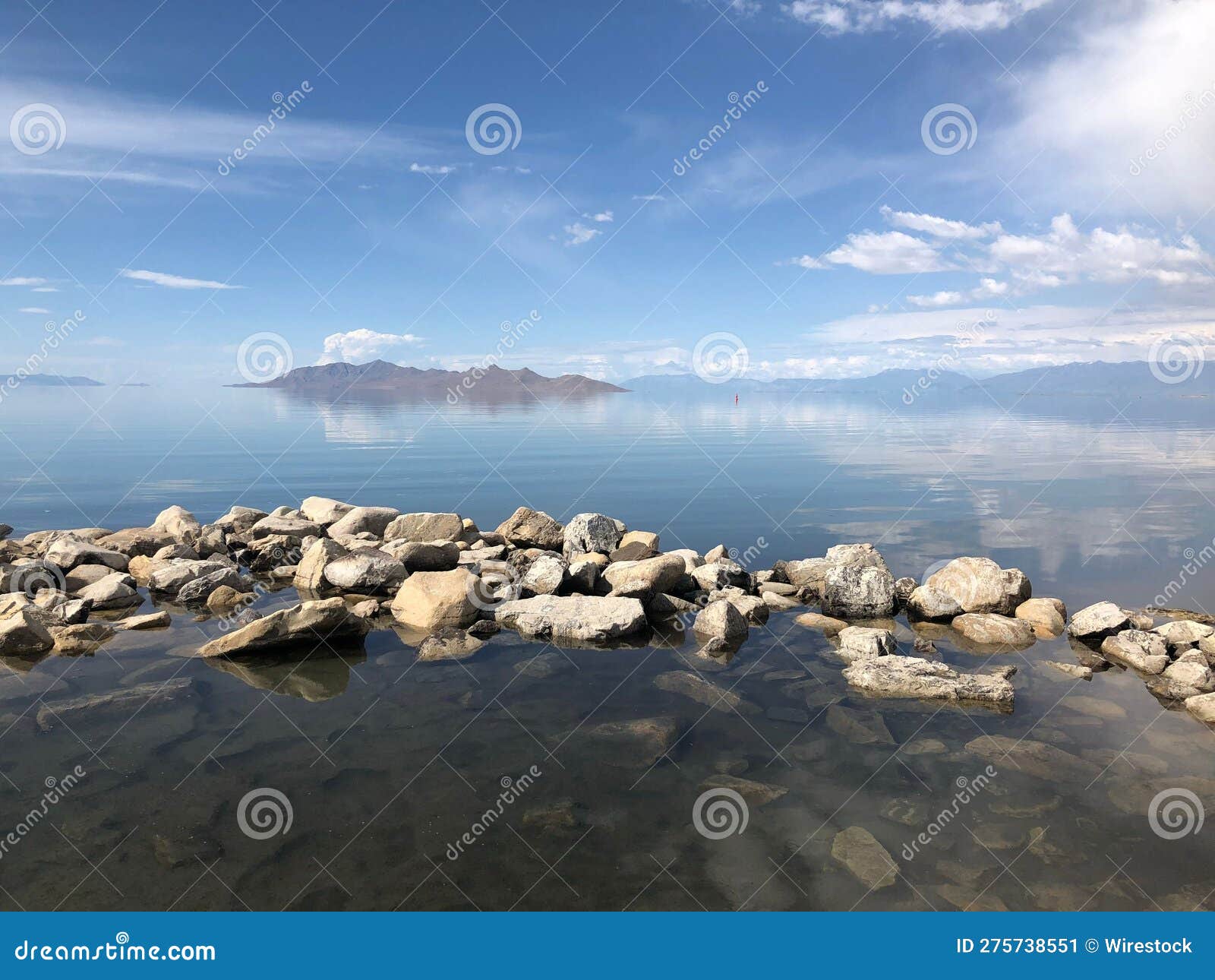 Idyllic Scene of a Tranquil Lake with Rock Barrier Stock Image - Image ...