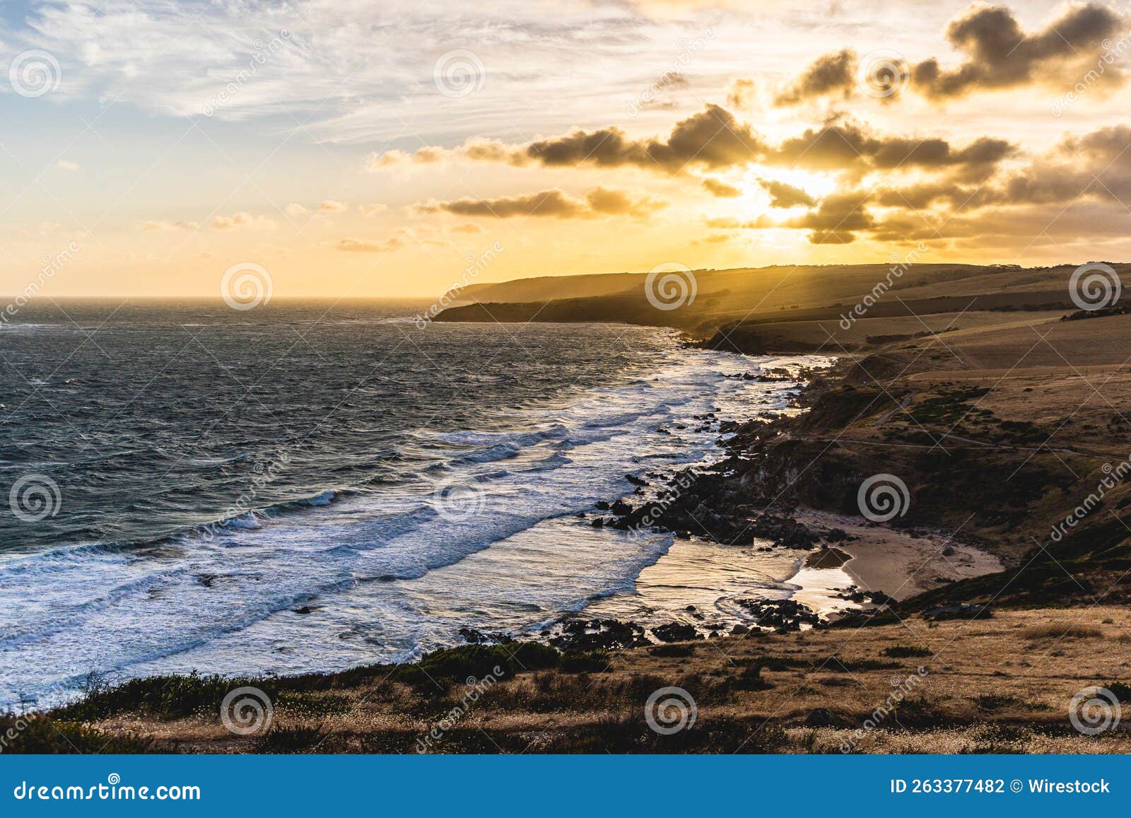 Idyllic Scenery of a Beach Being Washed by the Waves at Sunset Stock ...