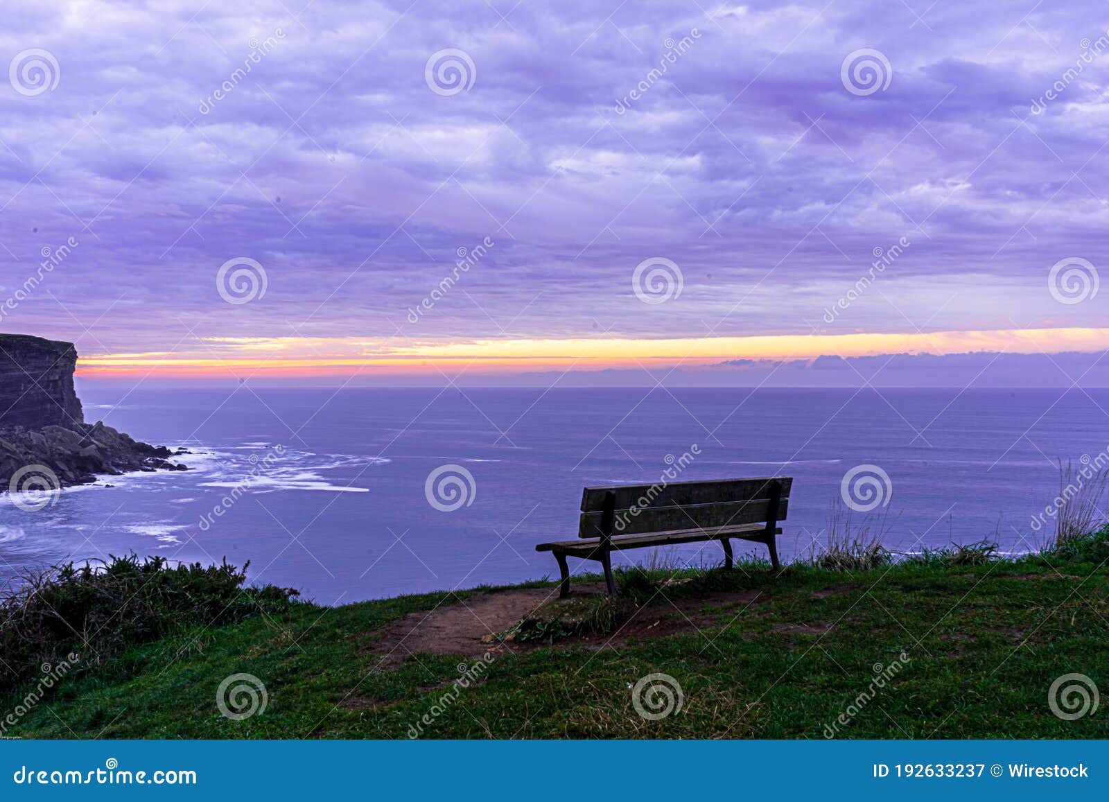 Idyllic View of a Sea from the Cliff with a Bench Under a Cloudy Sky ...