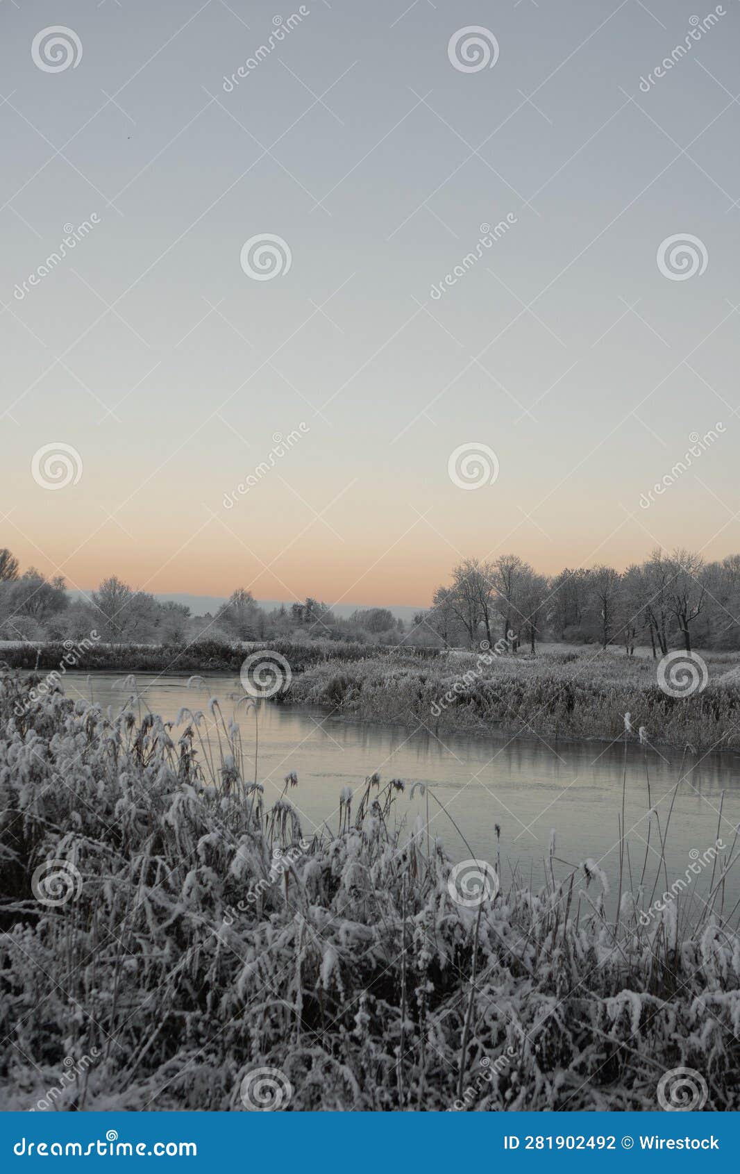 Idyllic Winter Scene of a Tranquil River Covered in a Layer of Ice ...